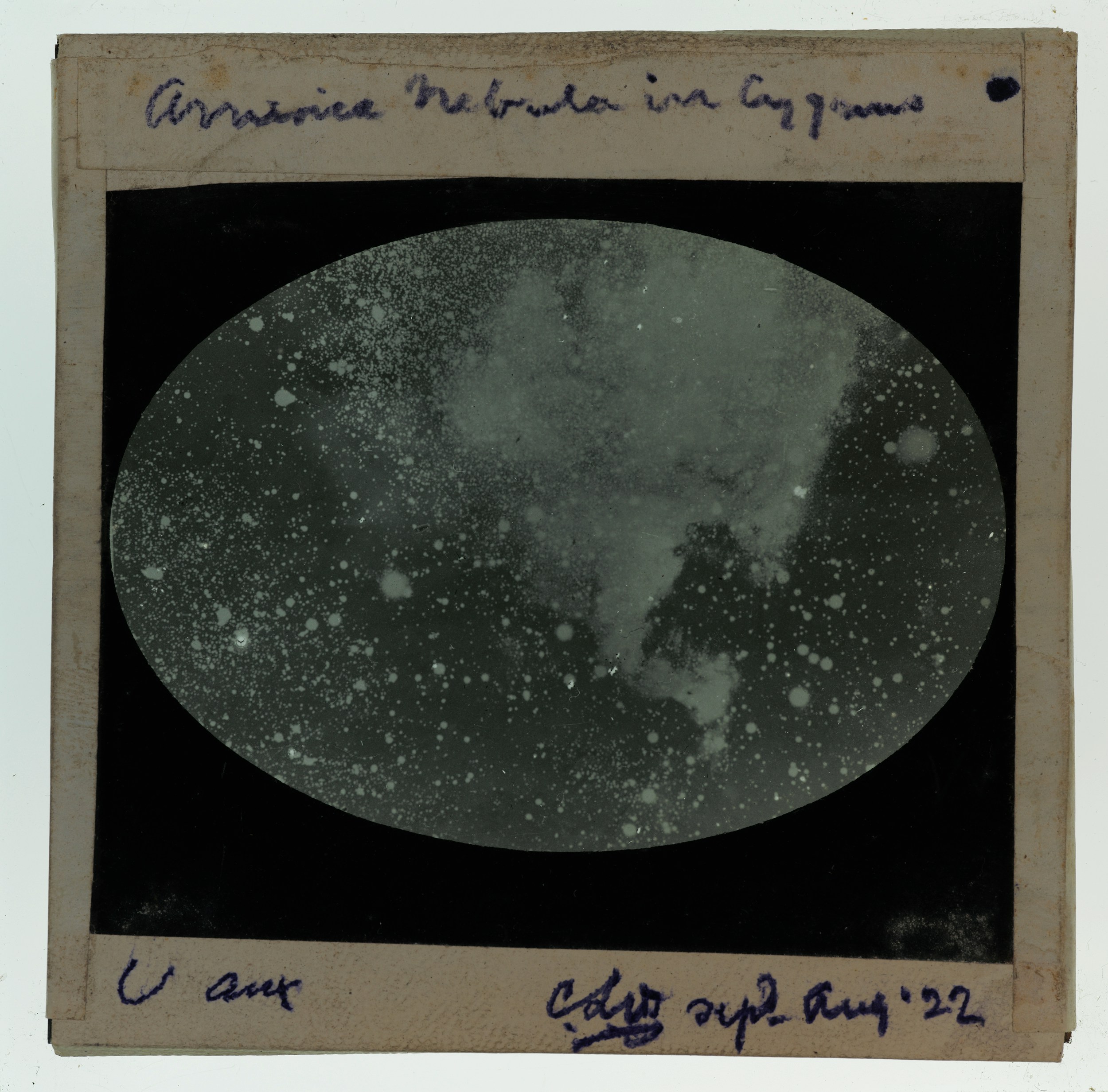 A lantern slide produced by Clement Lindley Wragge (b.1852, d.1922), dated 5 April 1905. The slide shows an oval shaped image of large cluster of stars surrounded by other stars with indication of orientation. Shared by Auckland War Memorial Museum, Tāmaki Paenga Hira, as part of the Clement Lindley Wragge collection. 236015|PH-1984-1-LS78-4-8. No known copyright restrictions. https://www.aucklandmuseum.com/discover/collections/record/1033201