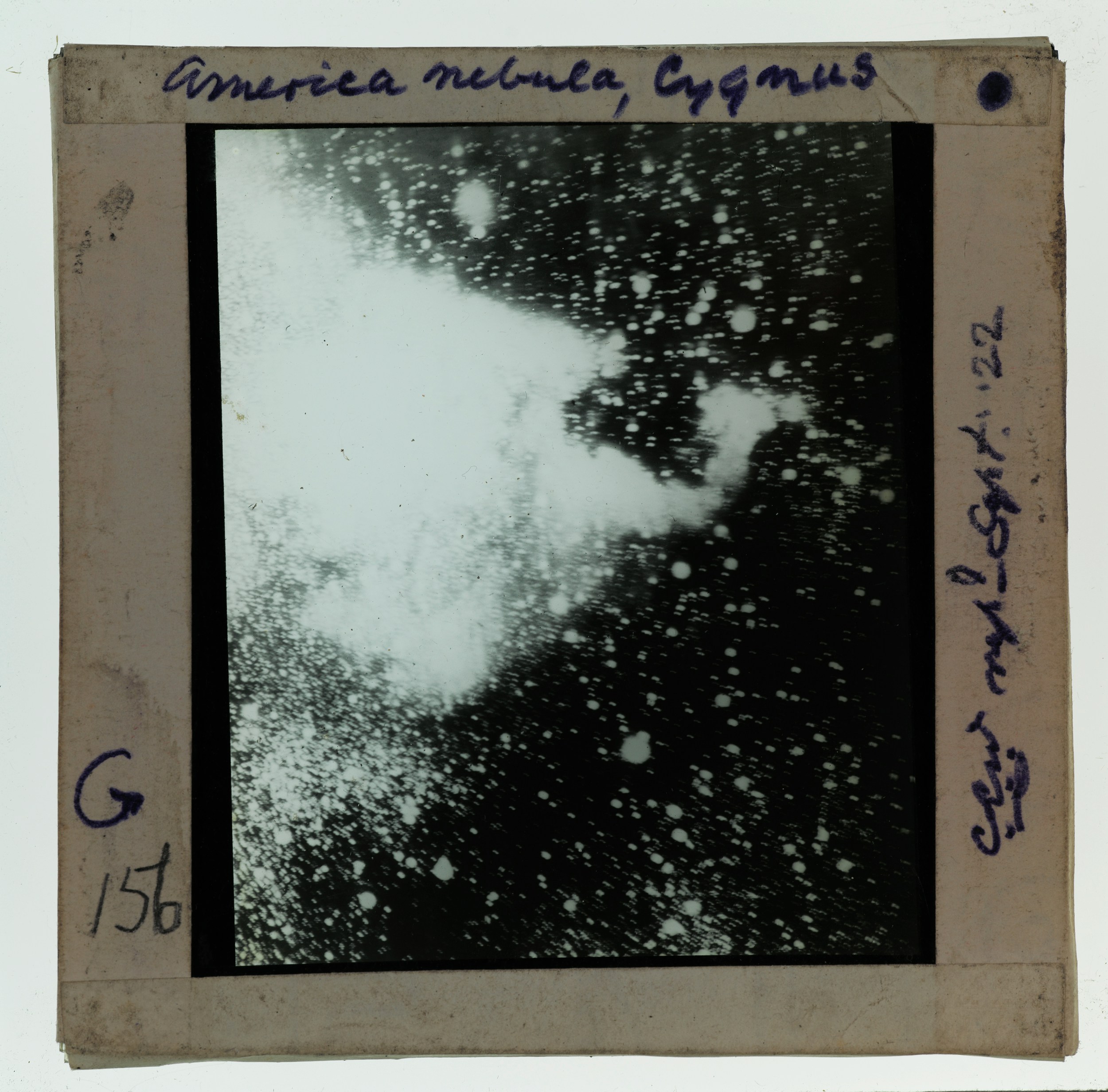 A lantern slide produced by Clement Lindley Wragge (b.1852, d.1922), dated 5 April 1905. The slide shows an image of a star cluster and surrounding stars in space, depicting America Nebula Cygnus. Shared by Auckland War Memorial Museum, Tāmaki Paenga Hira, as part of the Clement Lindley Wragge collection. 235995|PH-1984-1-LS78-3-66|56. No known copyright restrictions. https://www.aucklandmuseum.com/discover/collections/record/1033220