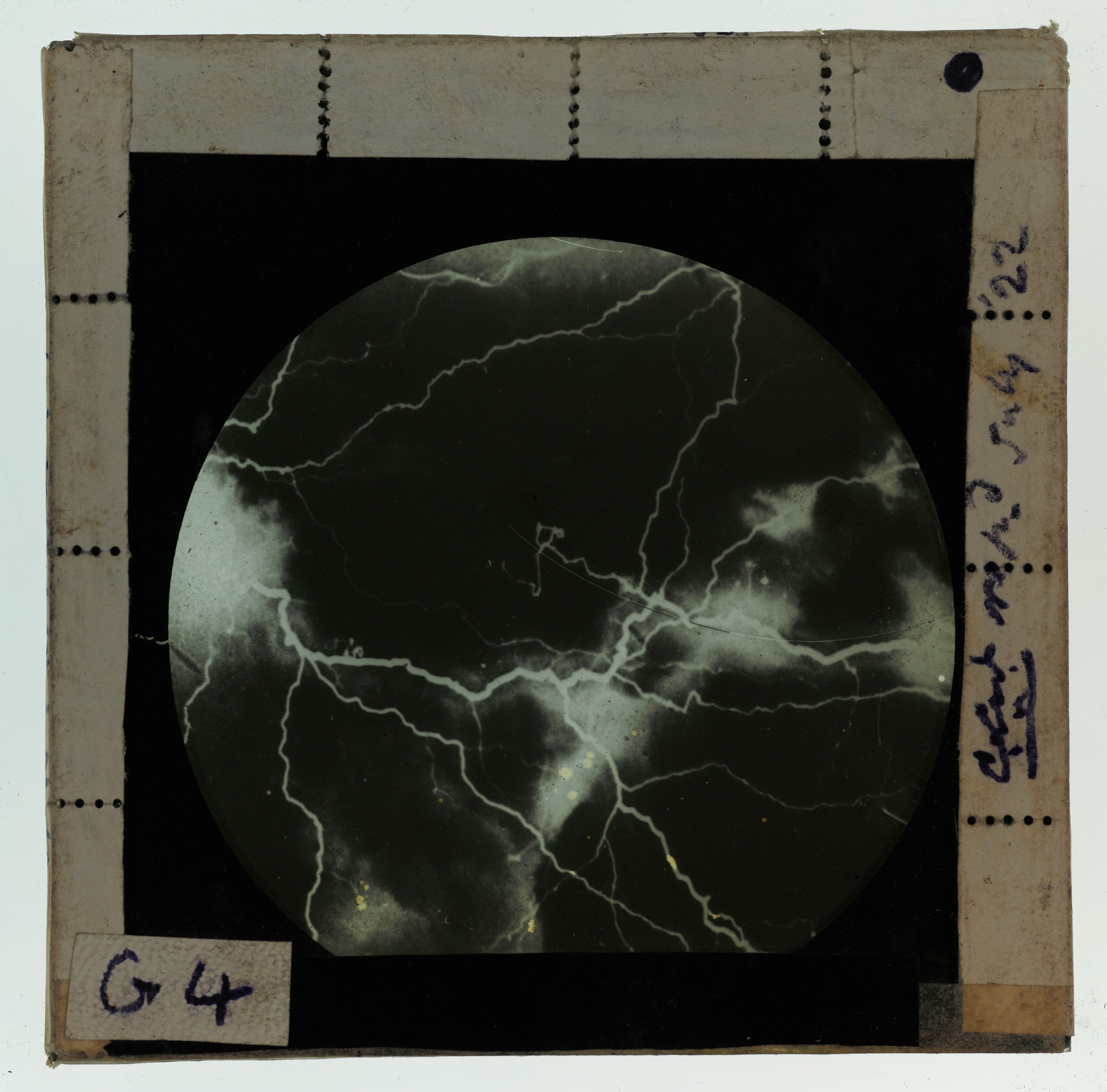 A lantern slide produced by Clement Lindley Wragge (b.1852, d.1922), dated 5 April 1905. The slide shows a circular image depicting clusters of electrical energy with radiating lighting strikes against a black background. Shared by Auckland War Memorial Museum, Tāmaki Paenga Hira, as part of the Clement Lindley Wragge collection. 235967|PH-1984-1-LS78-3-38|4. No known copyright restrictions. https://www.aucklandmuseum.com/discover/collections/record/1033248