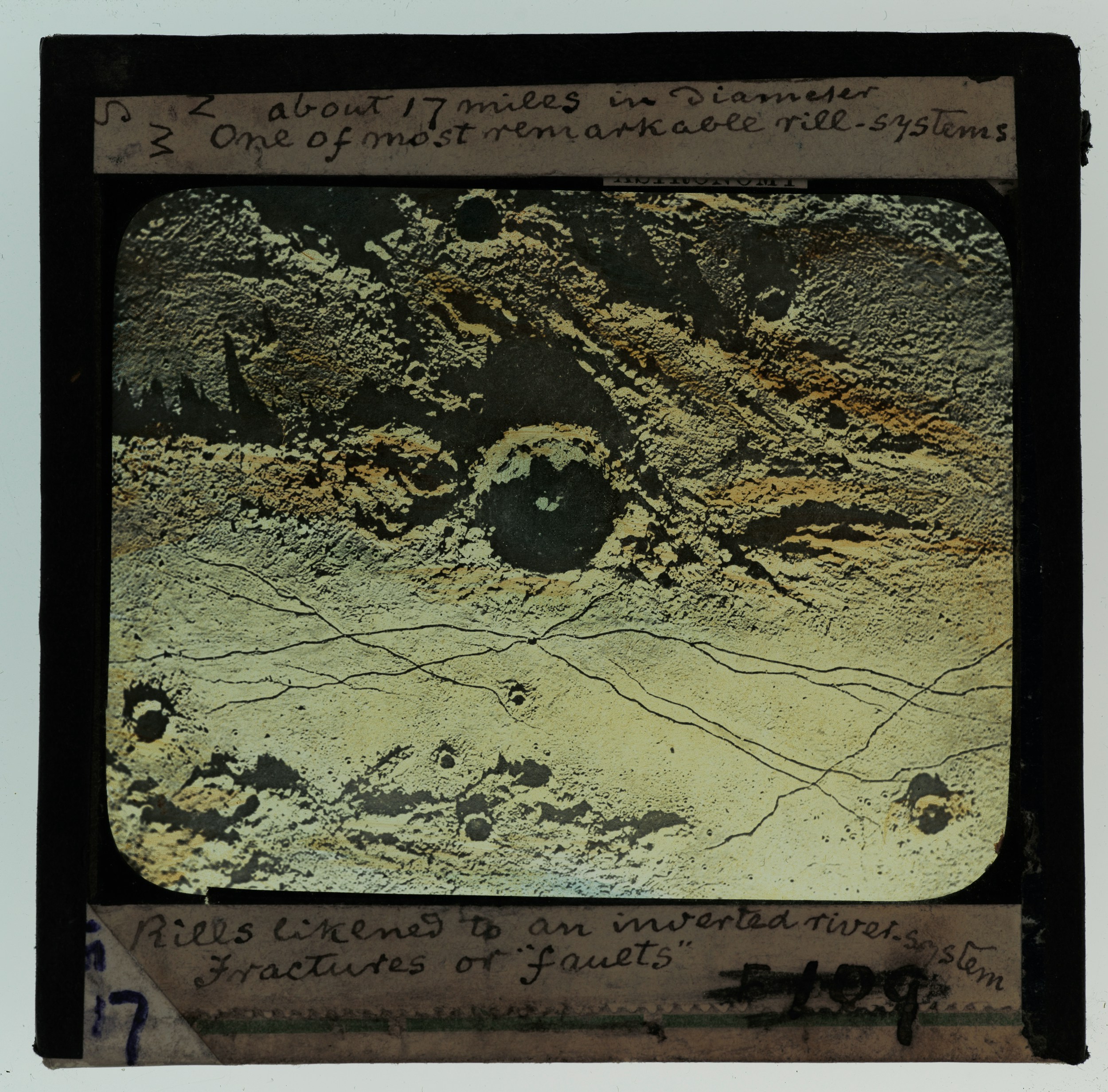A lantern slide produced by Clement Lindley Wragge (b.1852, d.1922), likely dating between 1890-1922. The slide shows an image of the surface of the moon, with details of fractures and craters. Shared by Auckland War Memorial Museum, Tāmaki Paenga Hira, as part of the Clement Lindley Wragge collection. 235962|PH-1984-1-LS78-3-33|17. No known copyright restrictions. https://www.aucklandmuseum.com/discover/collections/record/1033253
