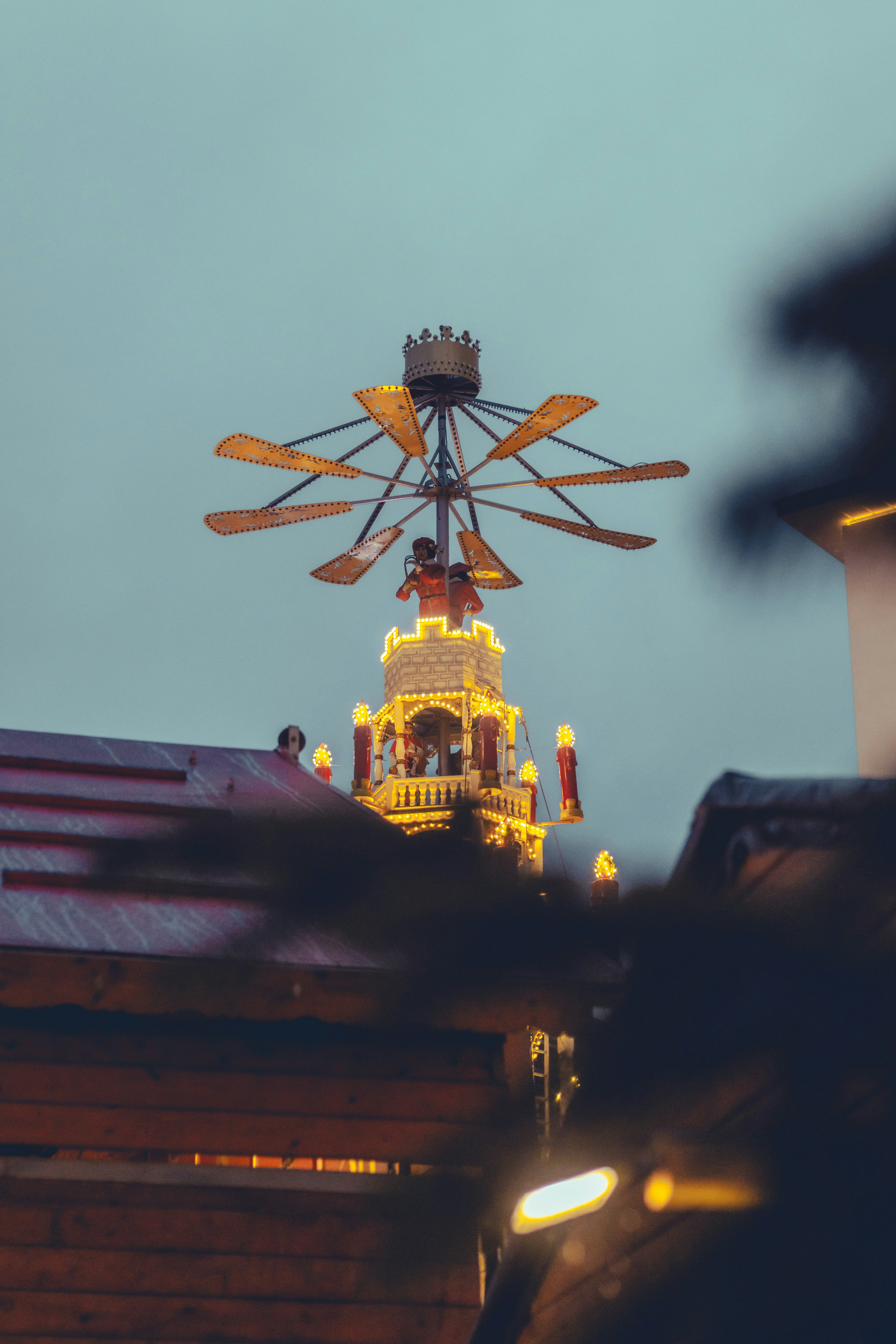 Ferris Wheel Crown: Neon Ride Above the Market Tower
