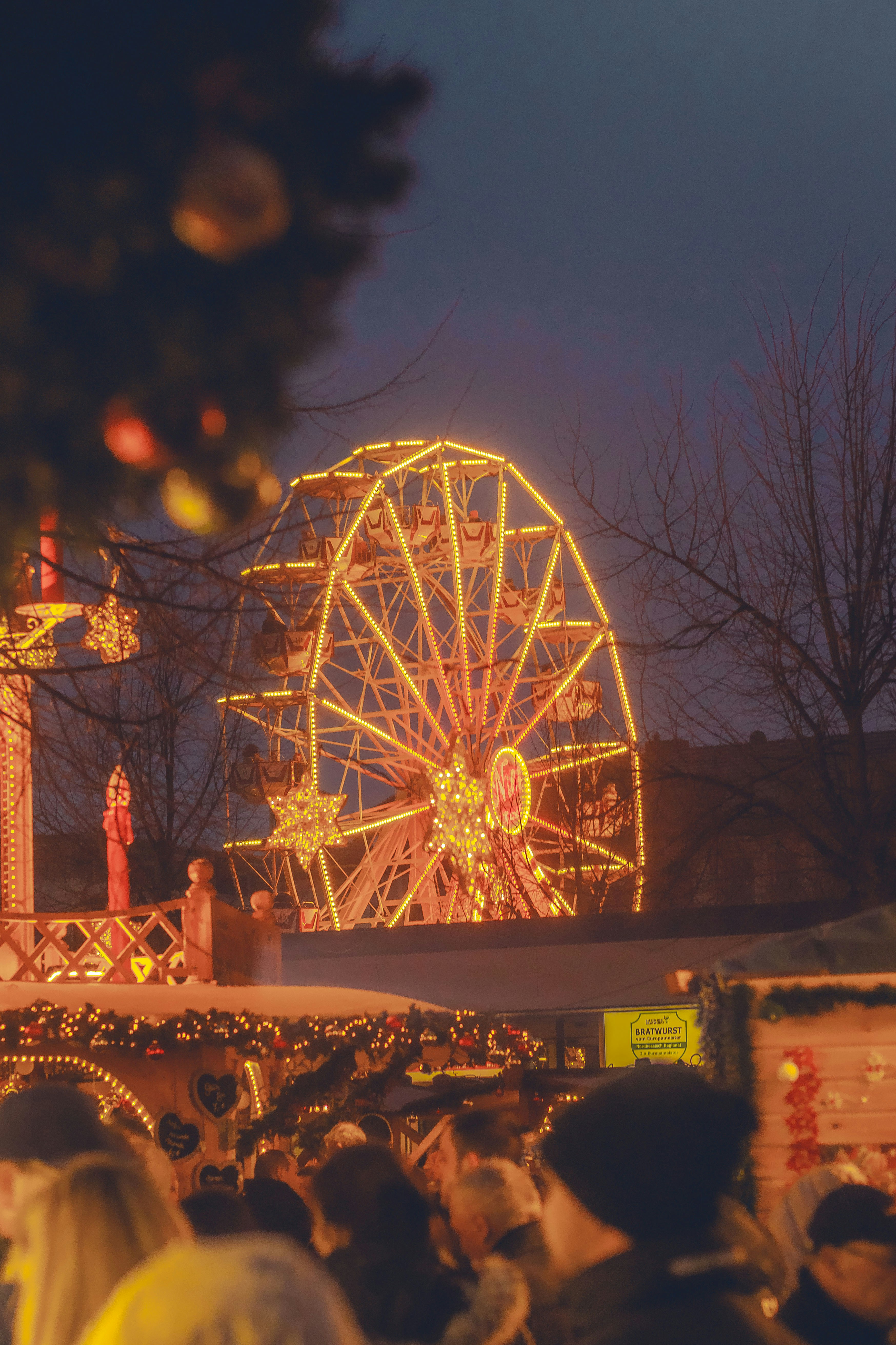 Golden Ferris Wheel Above the Winter Market