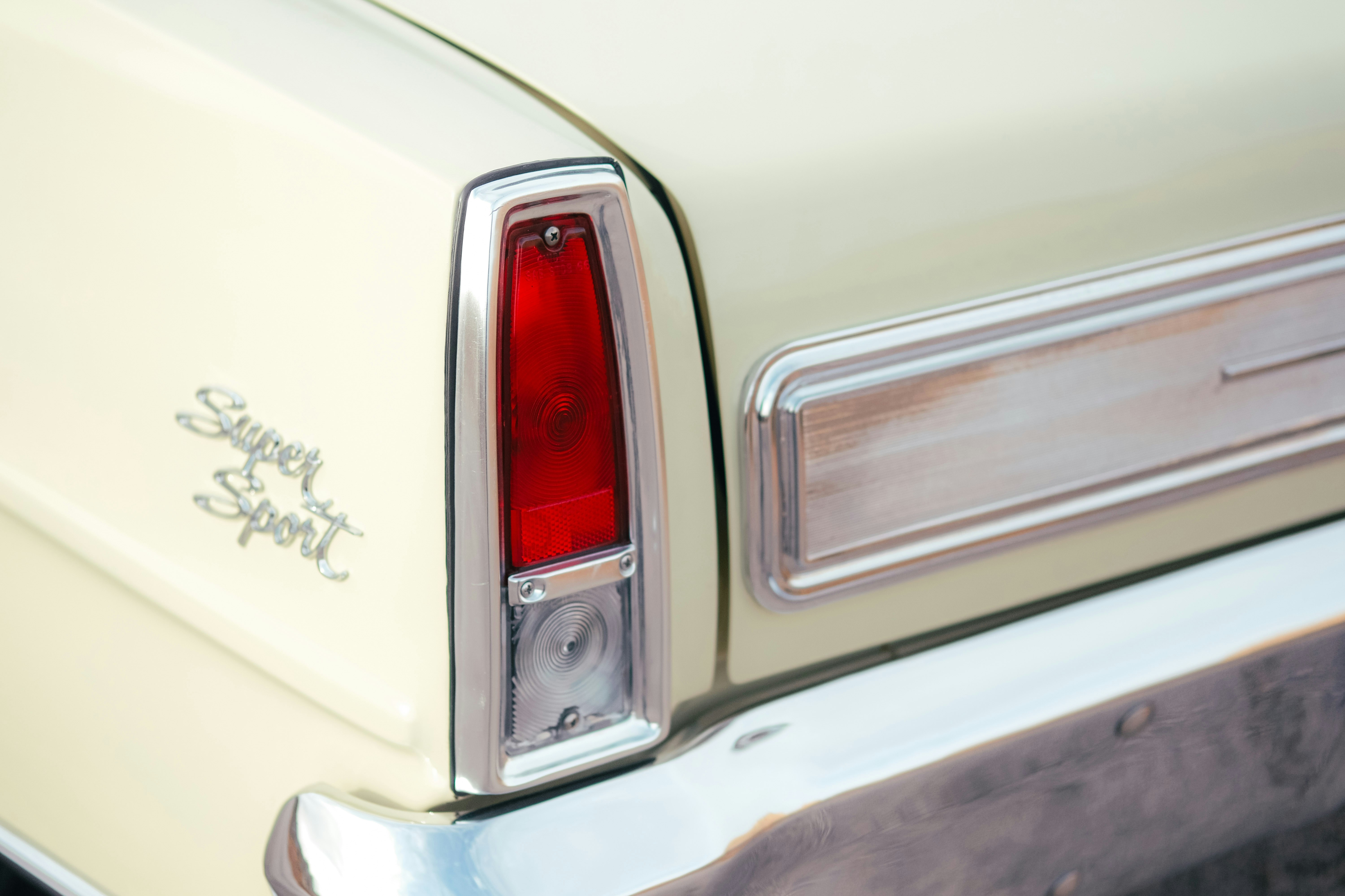 Pastel Vintage: Tail Light and Script Emblem in Soft Focus