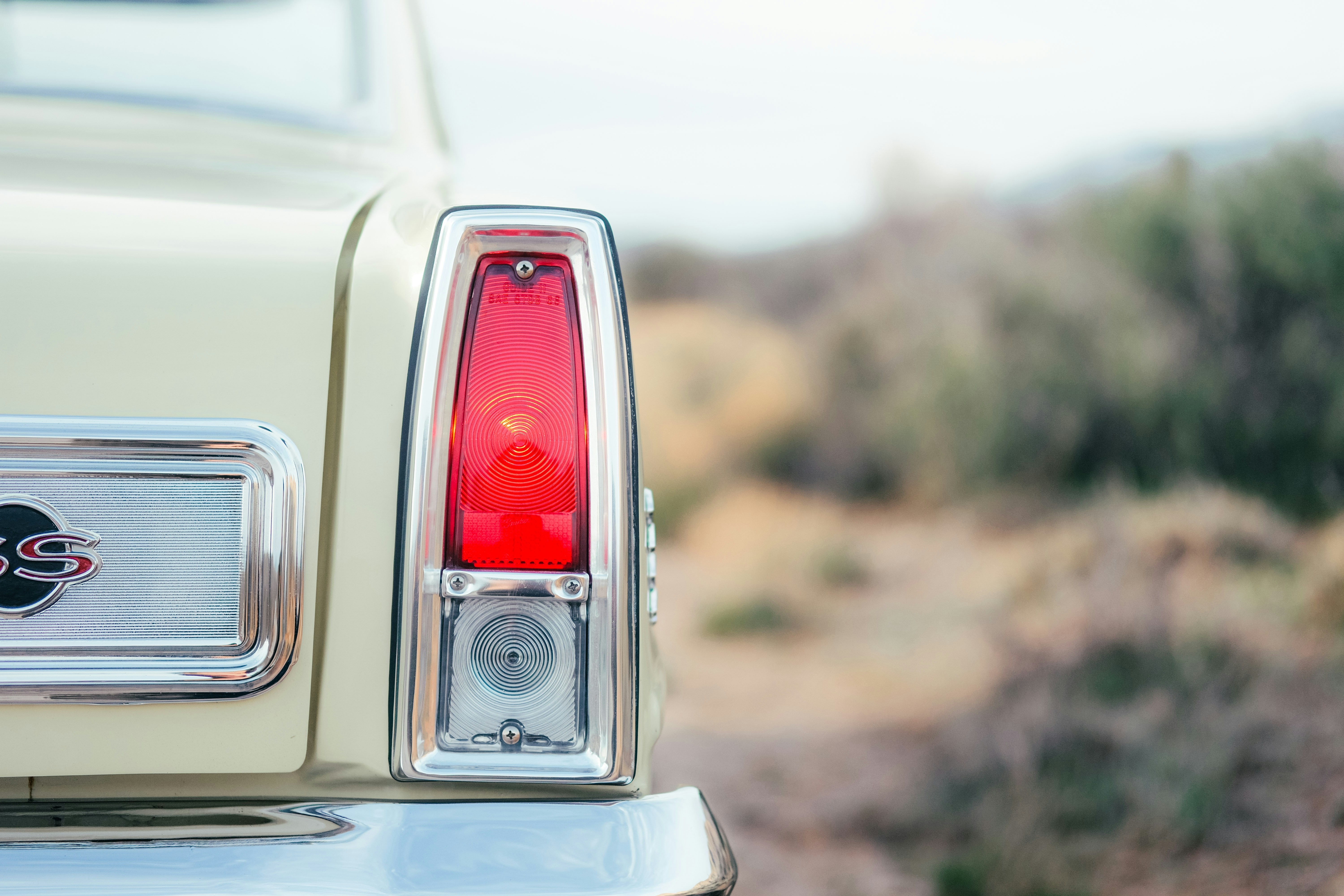 Rear-tail Light Portrait: Vintage Car’s Tailfin in Soft Focus