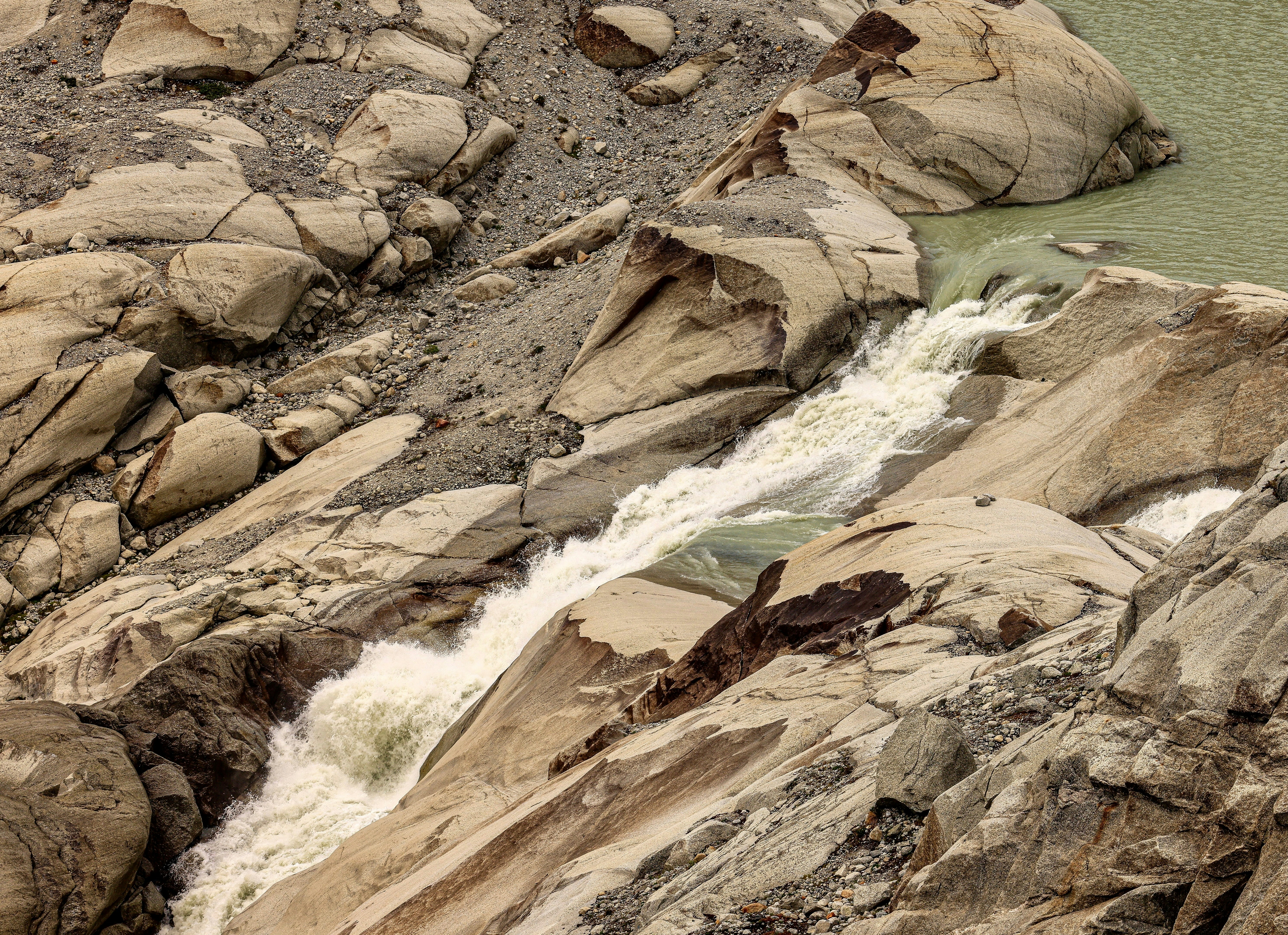 Rugged river cut: light-toned massifs carving a serpentine flow