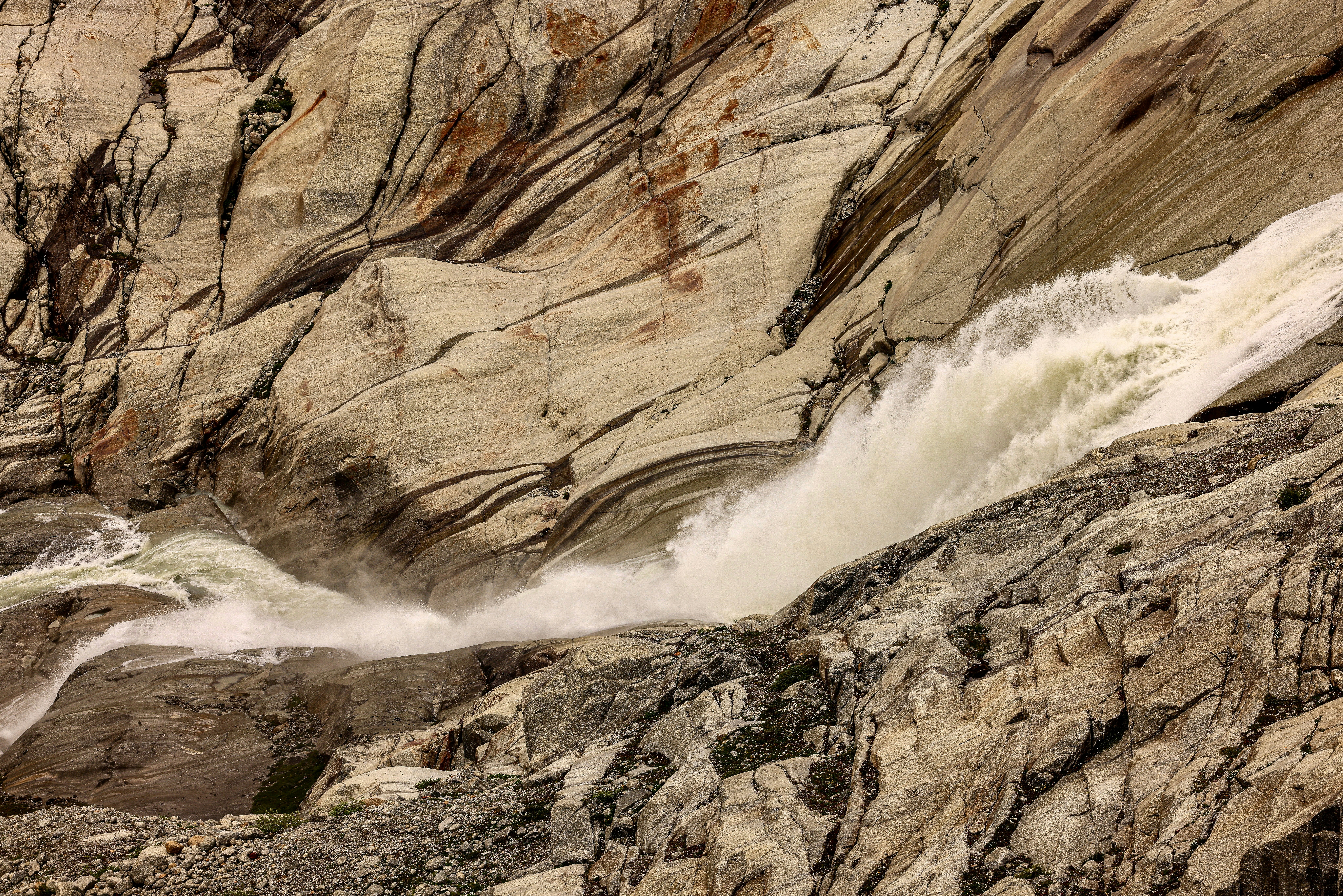 Rugged cascade carving its path through weathered granite