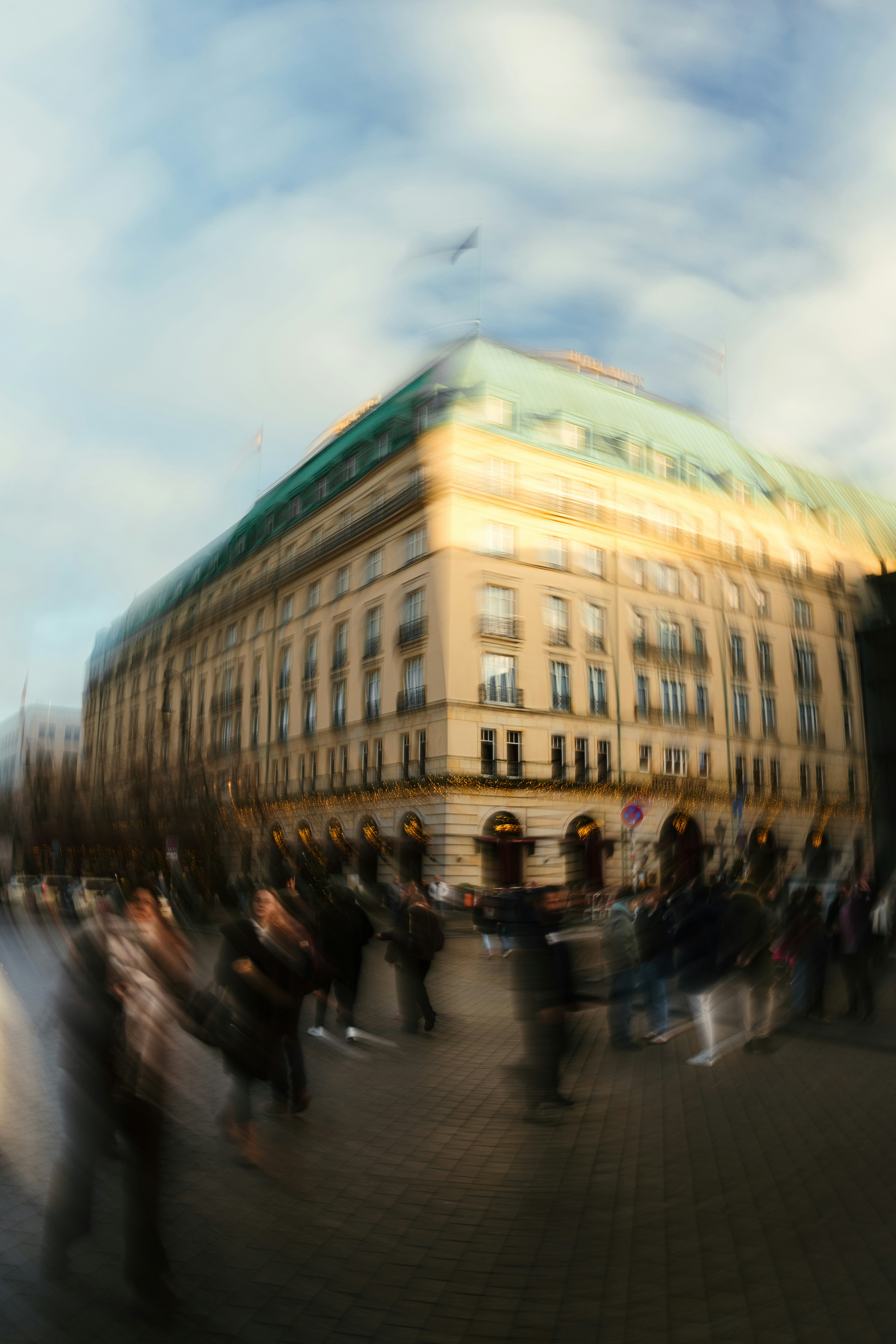 City Arcade in Motion: Blurred Footfall Beneath a Grand Facade