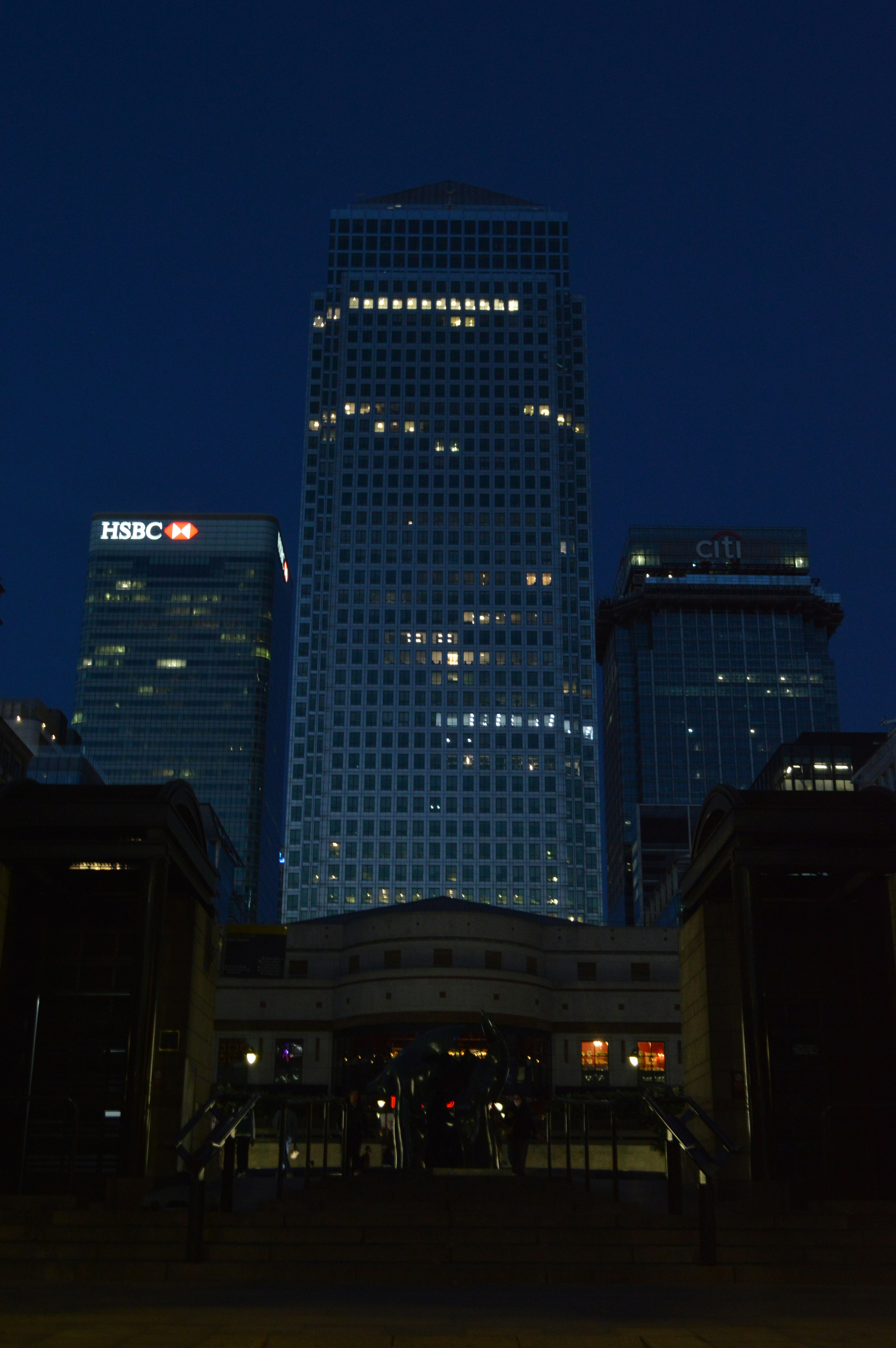 Night Kickoff: Cornerstone Tower Rising into City Lights
