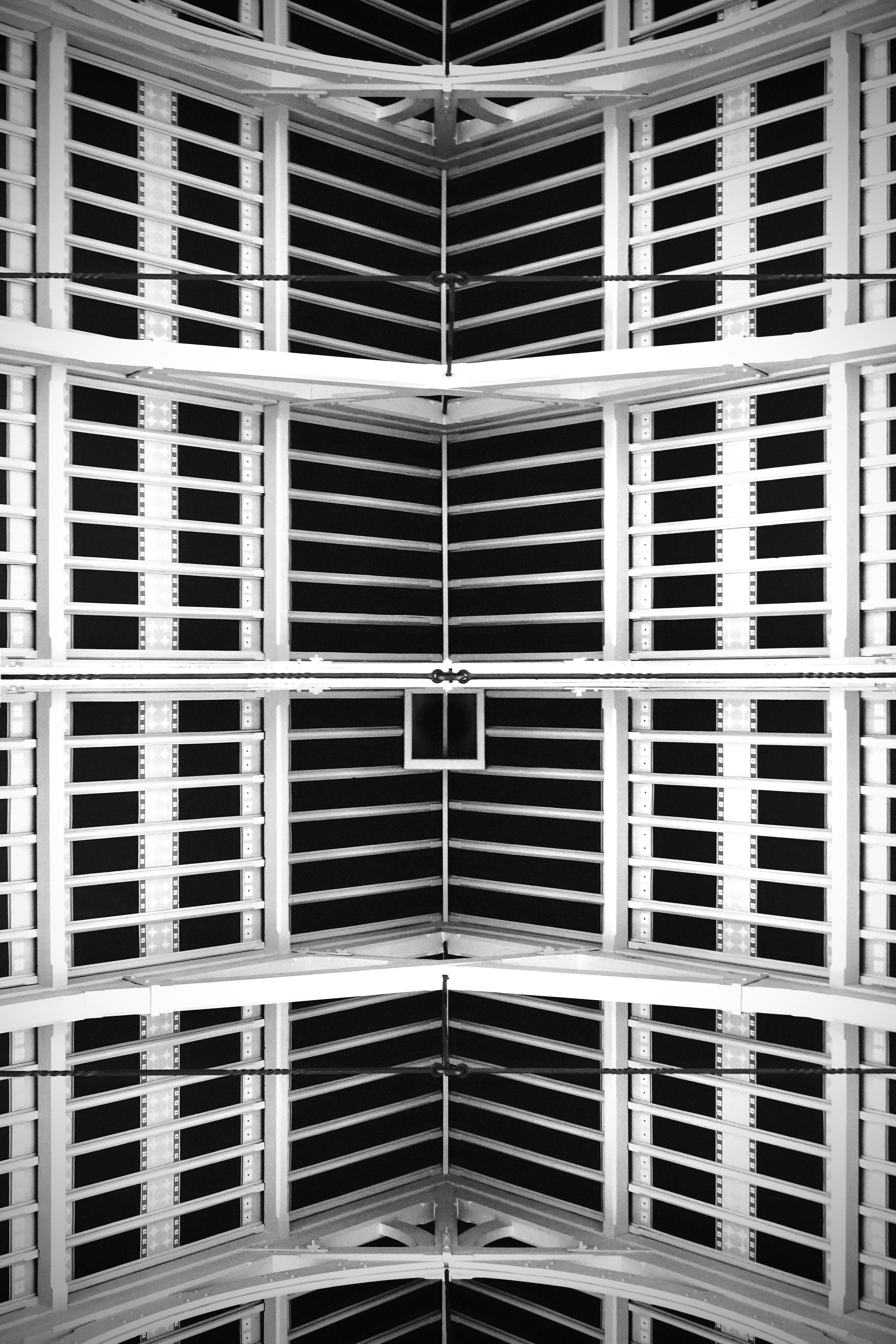Symmetrical Steel Lattice: A Monochrome Architectural Convergence