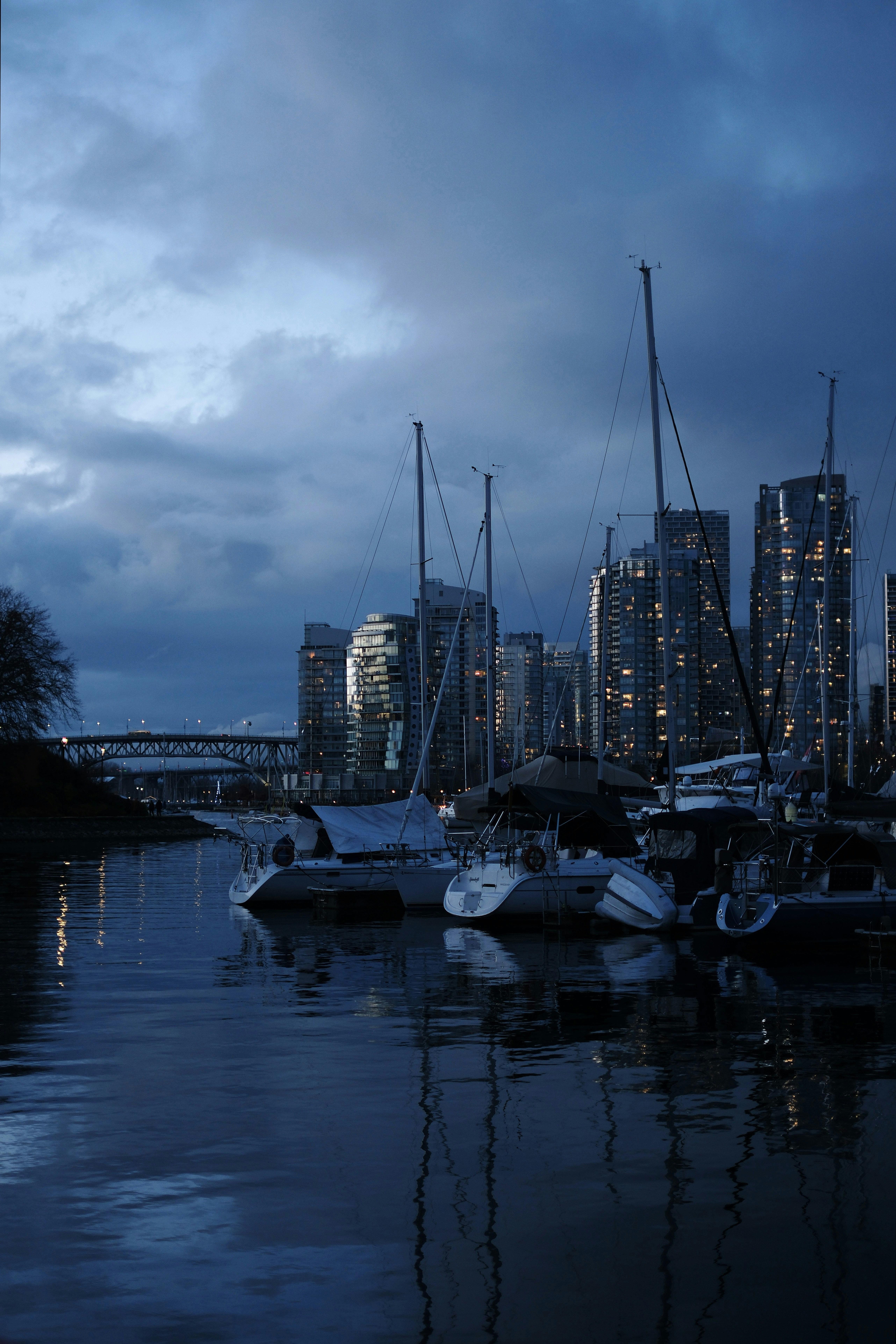 Dusk Marina: Sleek Sails Against a Neon City Skyline