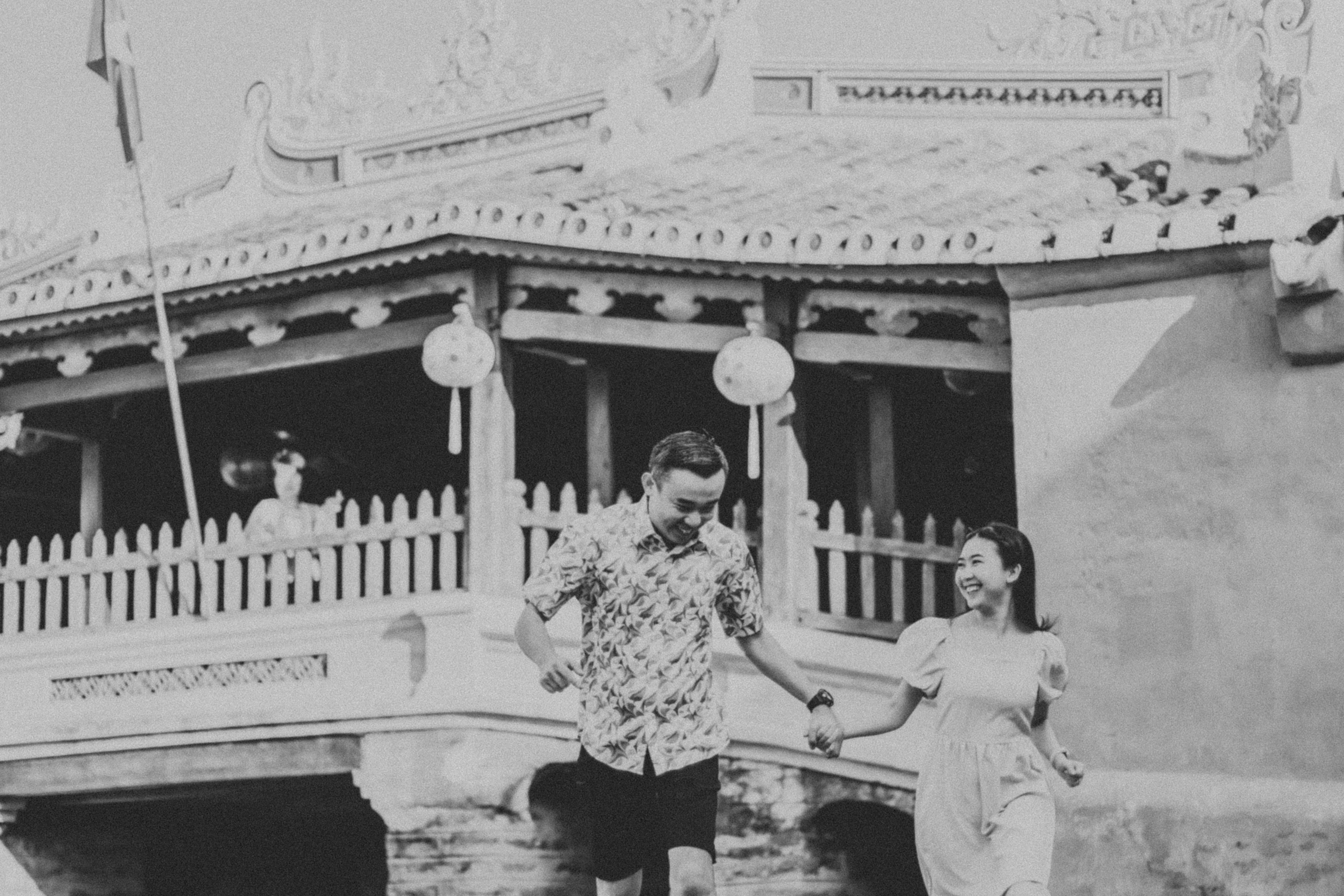 Couple in Harmony Before a Traditional Facade