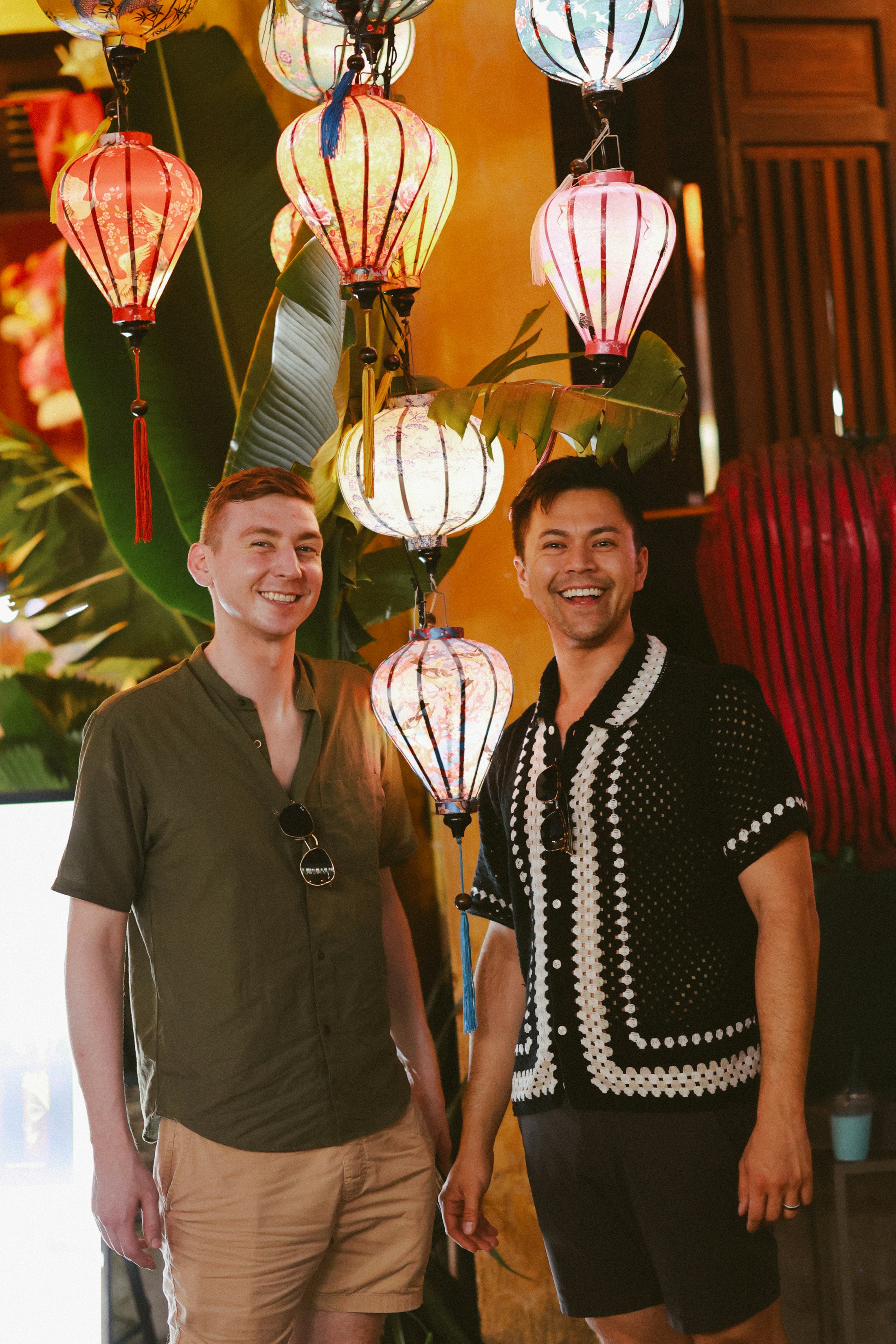 Lantern-lit Duo: Friends Beneath the Garden Glow
