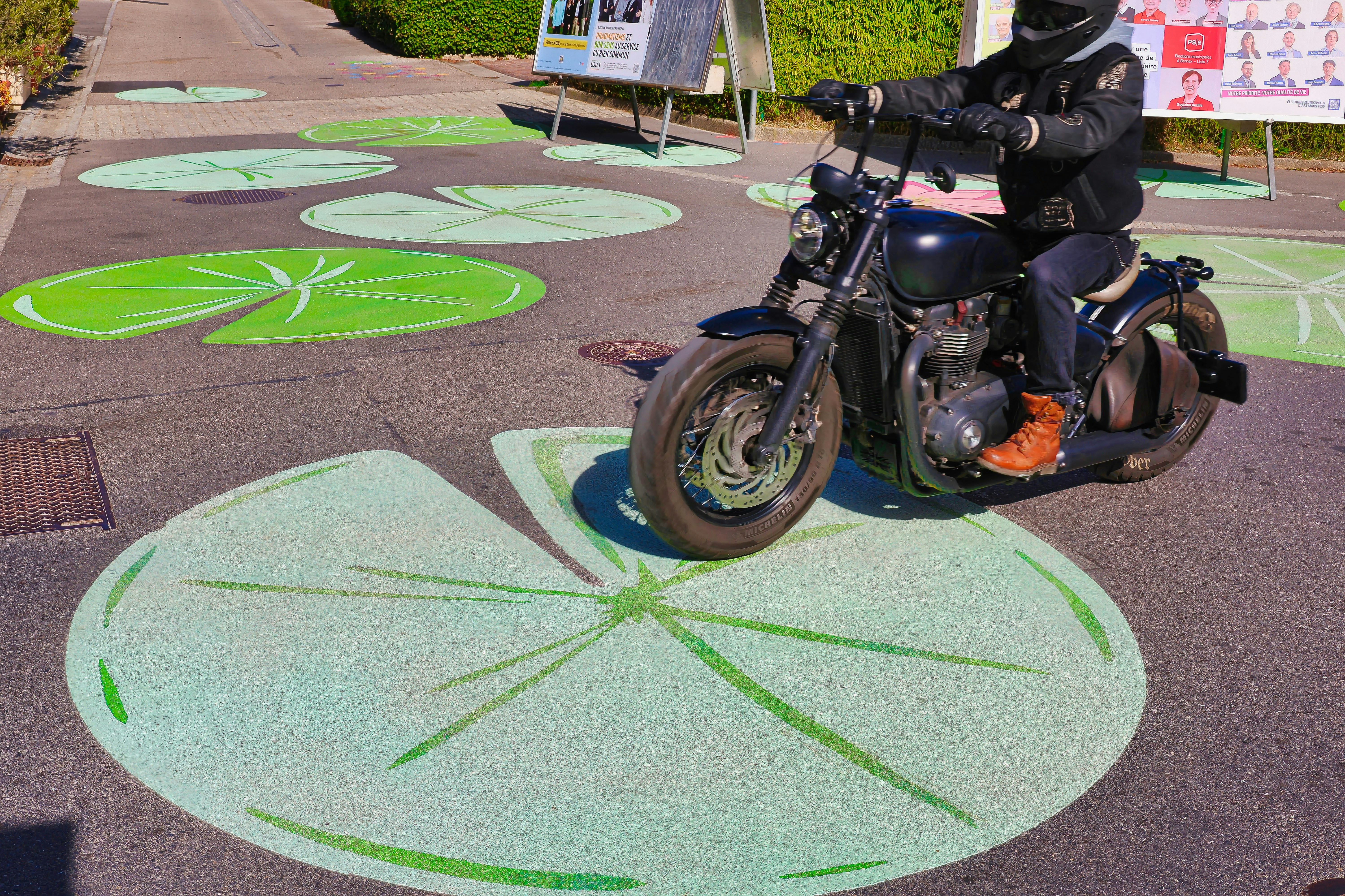 Front Wheel Stanced on a Leaf-Creen Courtyard: A Retro Motorcycle Tour