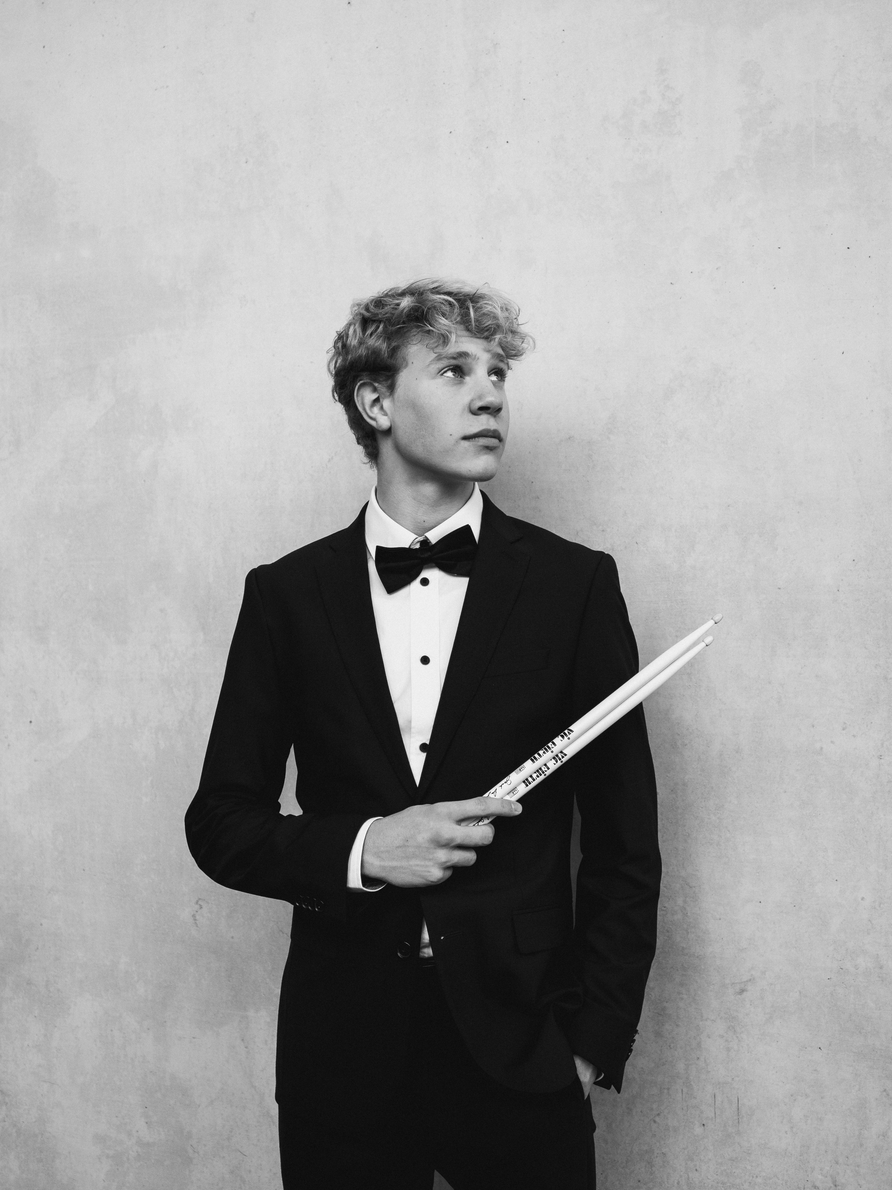 A Dapper Moment: Youthful Sartorial Quiet with Drumsticks