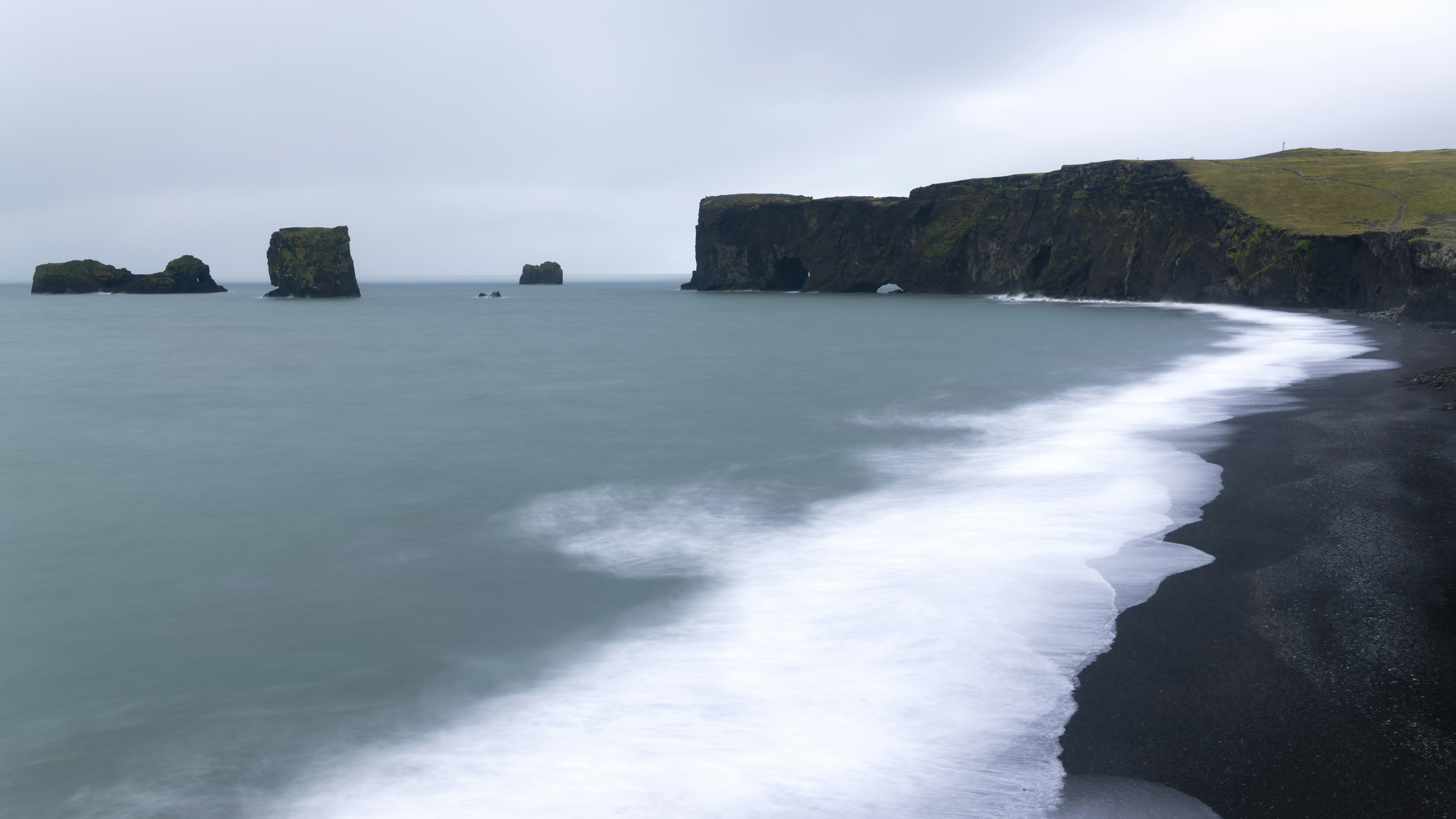 A Misty Atlantic Curve: Charcoal Shore and Sea Stokes