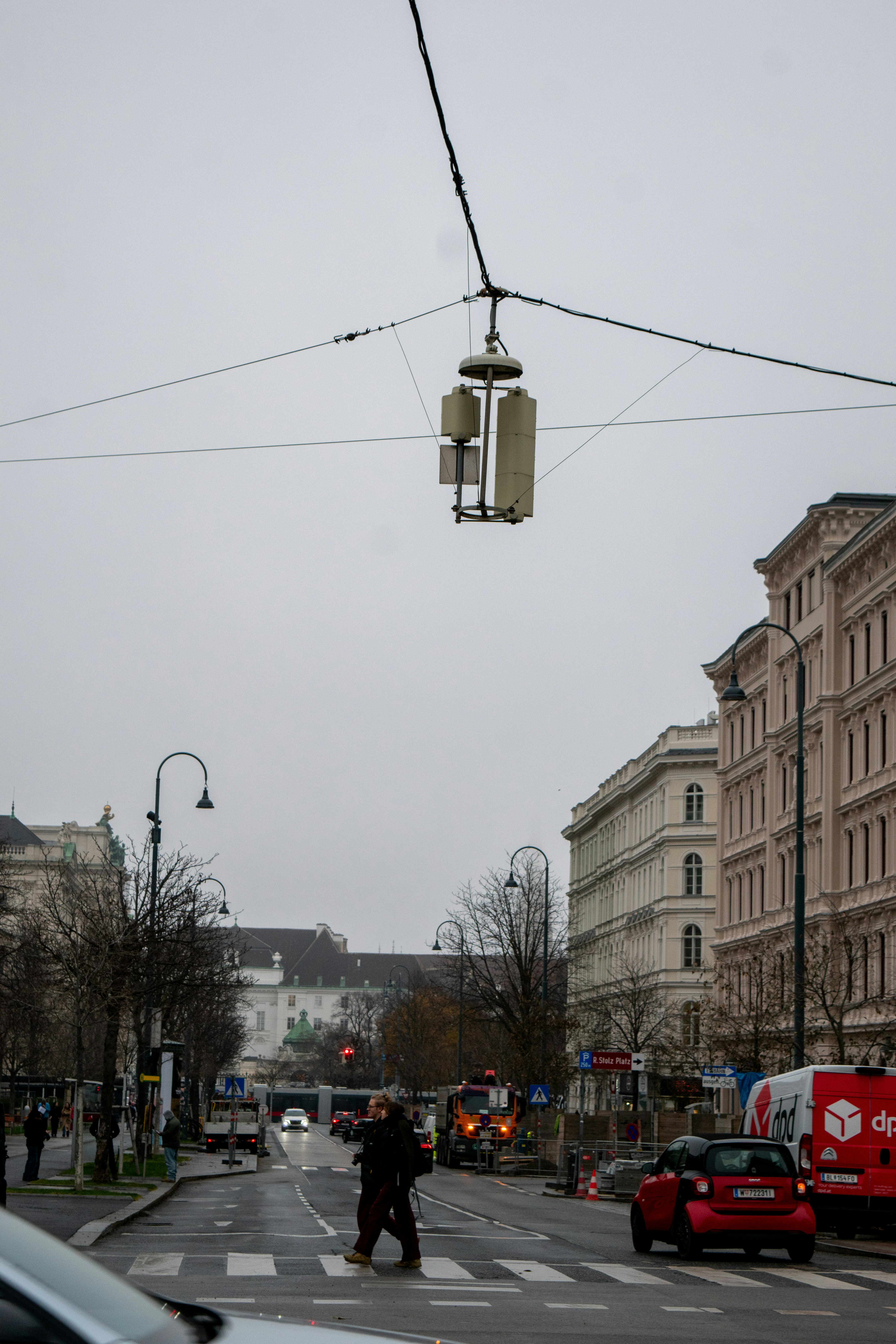 Overhead Tram Cables Framing a Quiet City Street