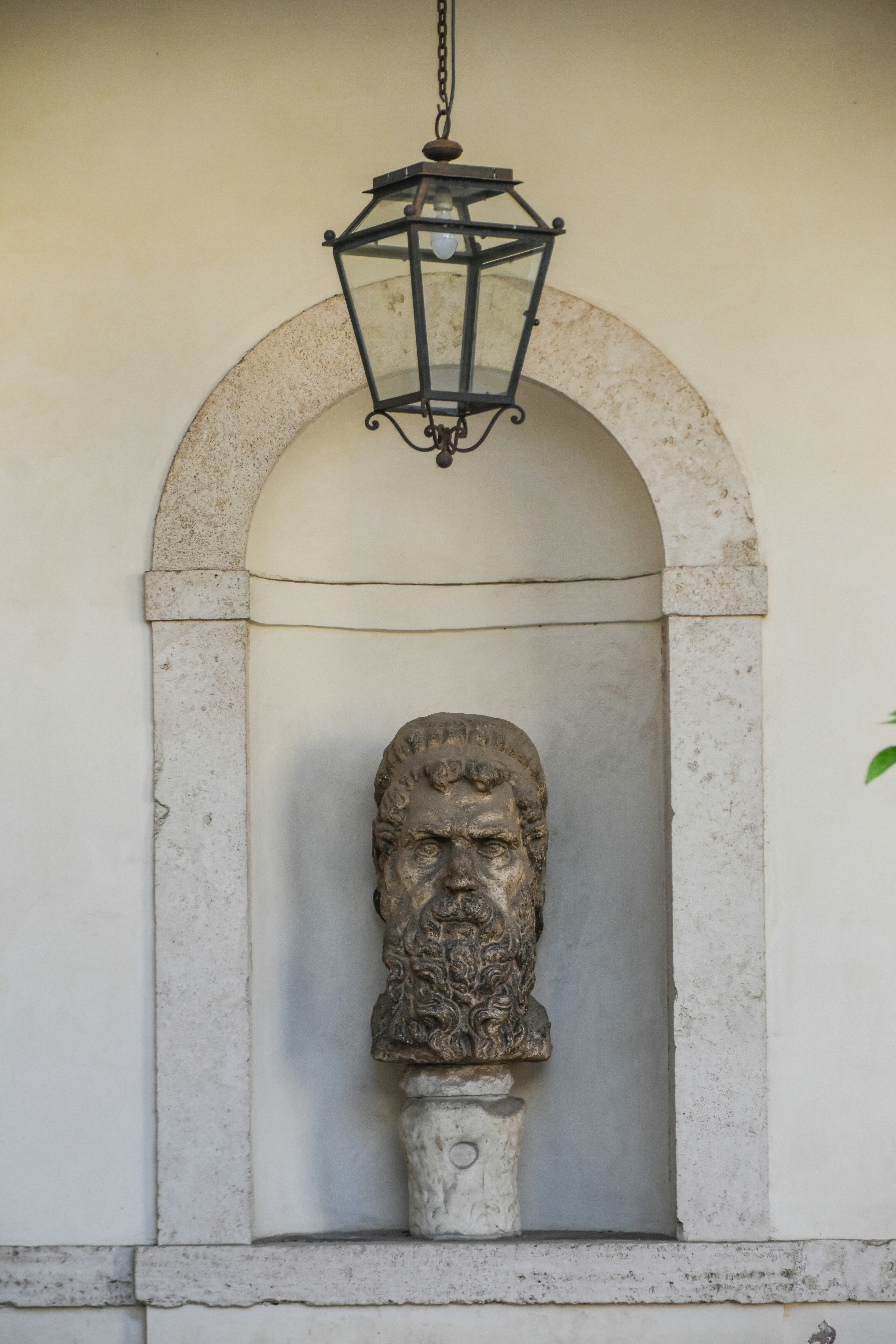 Stone bust of a bearded man under a lantern photo – Free Art Image on ...