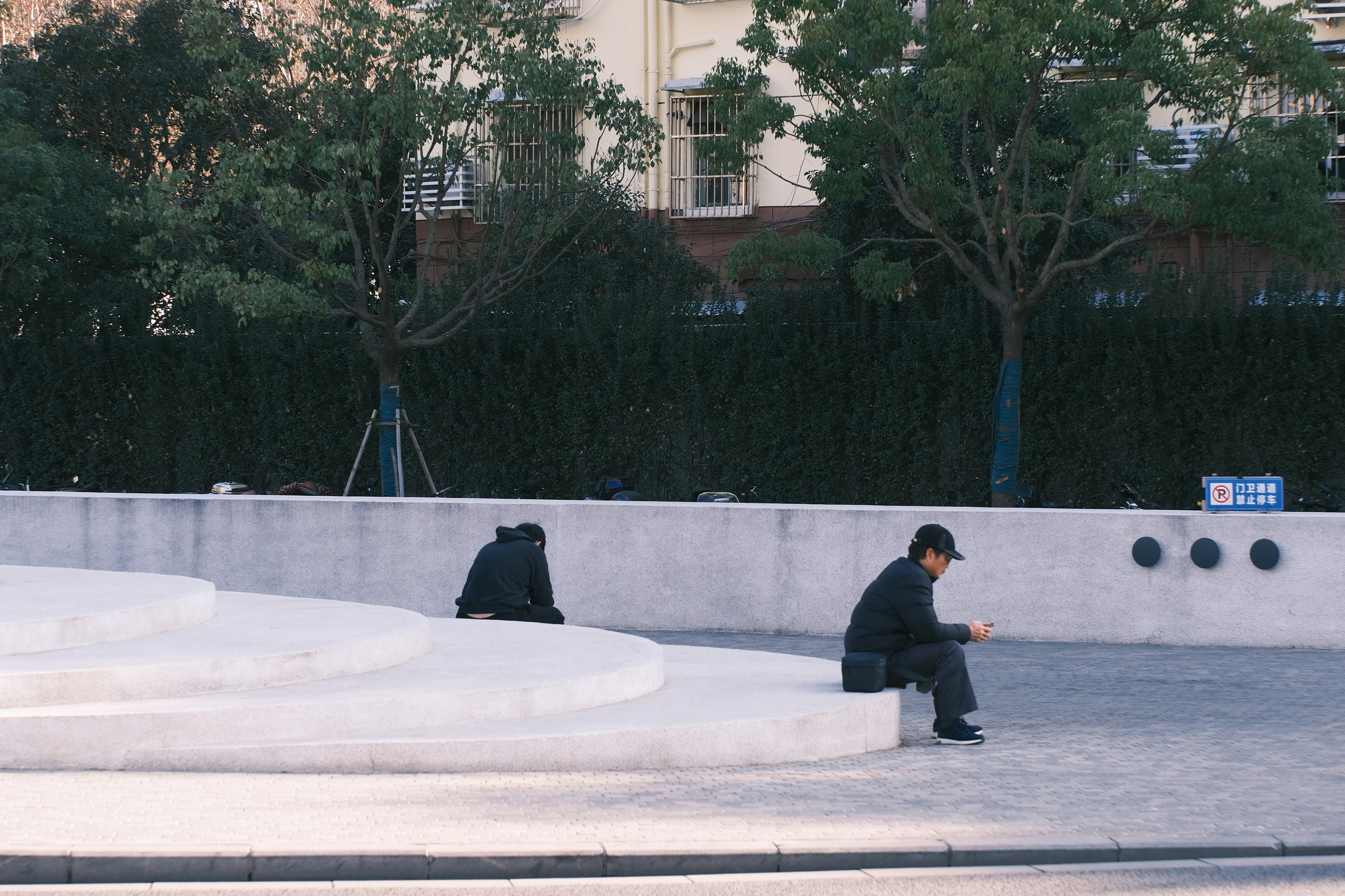 Solitary Moment on Step: A Quiet City Bench