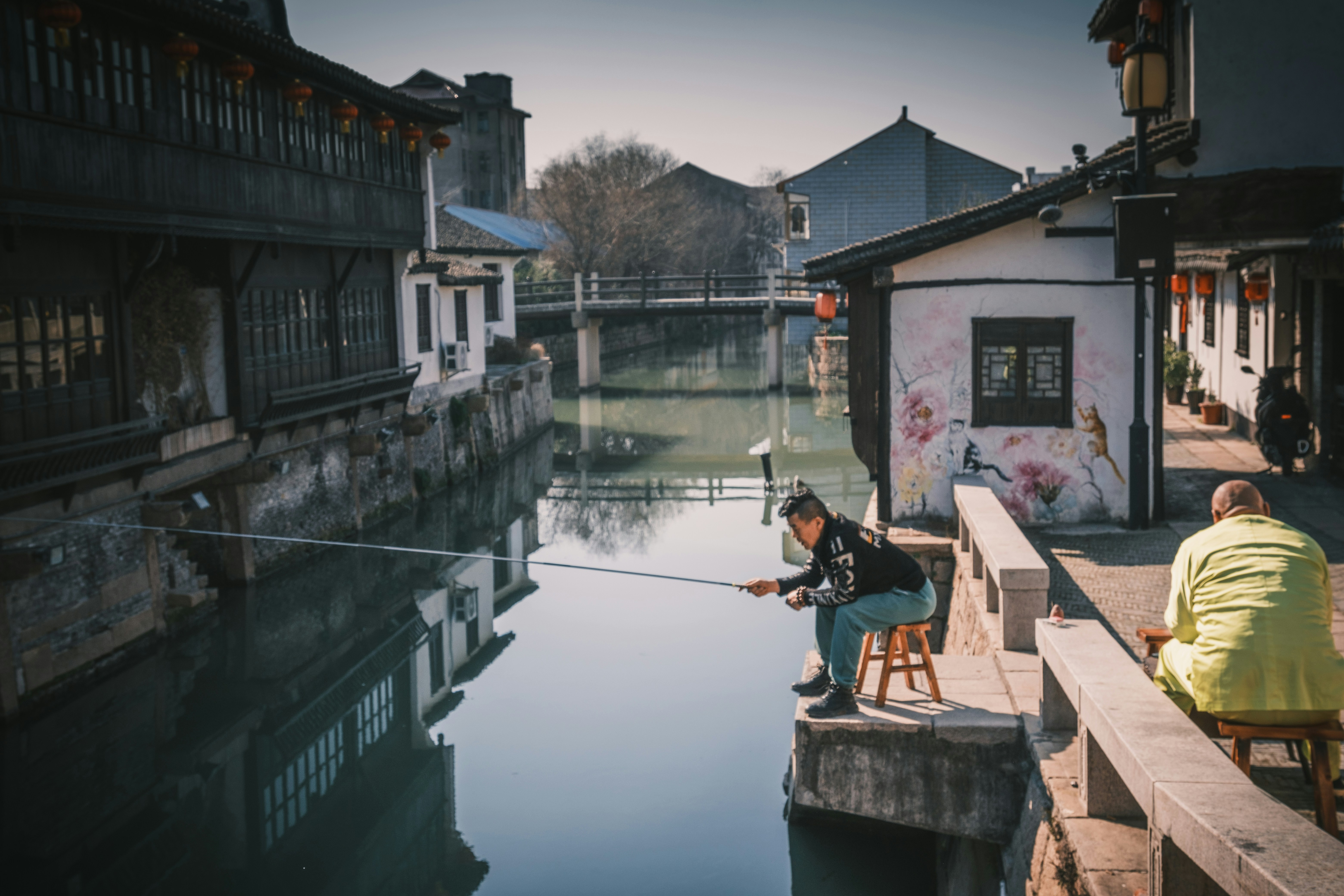 Casting Line, Quiet Canal: A Fisherman Sketches in an Ancient Waterway