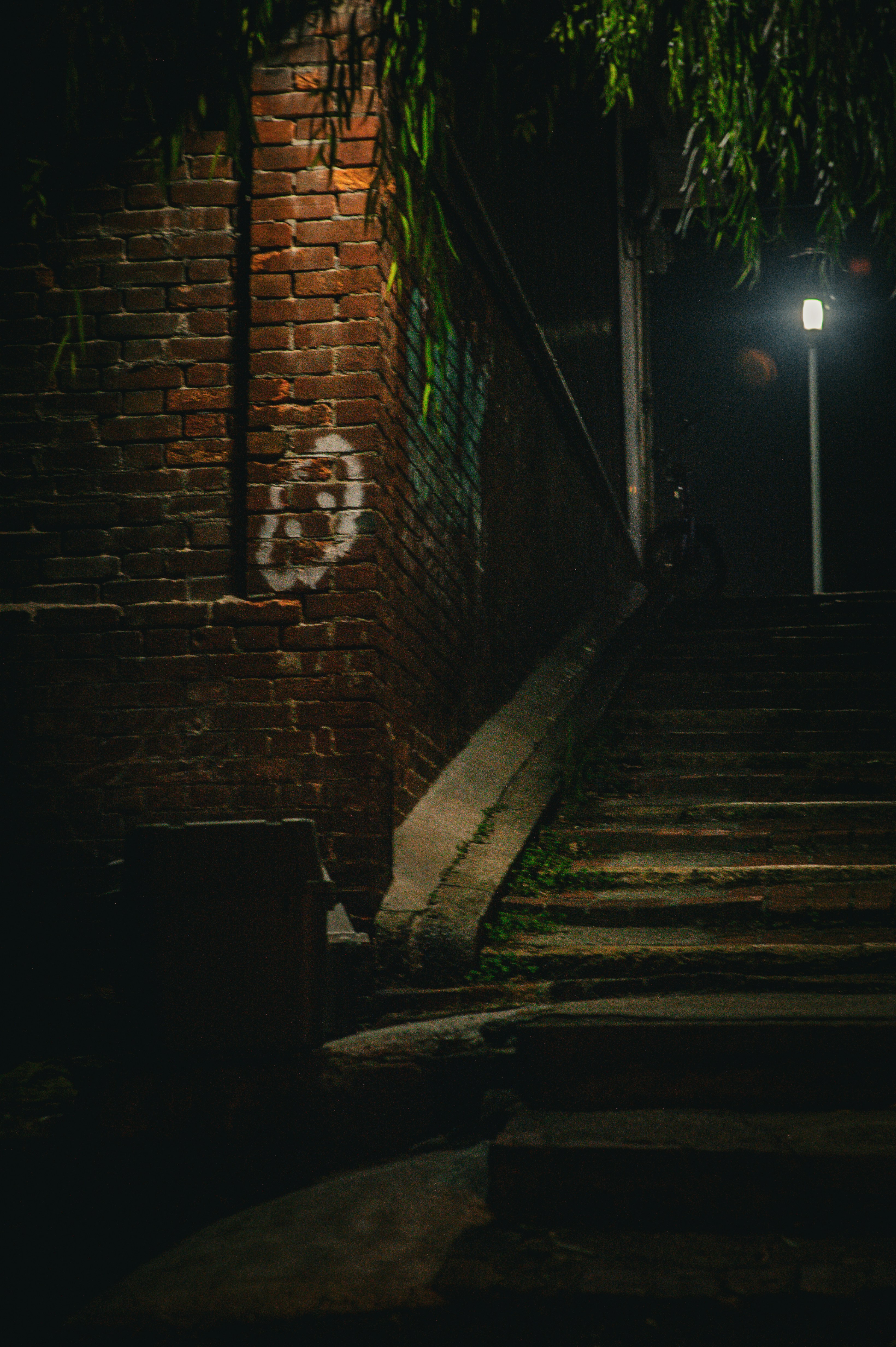 Midnight Staircase: A Quiet Stairwell Echoing a Streetlamp's Glow