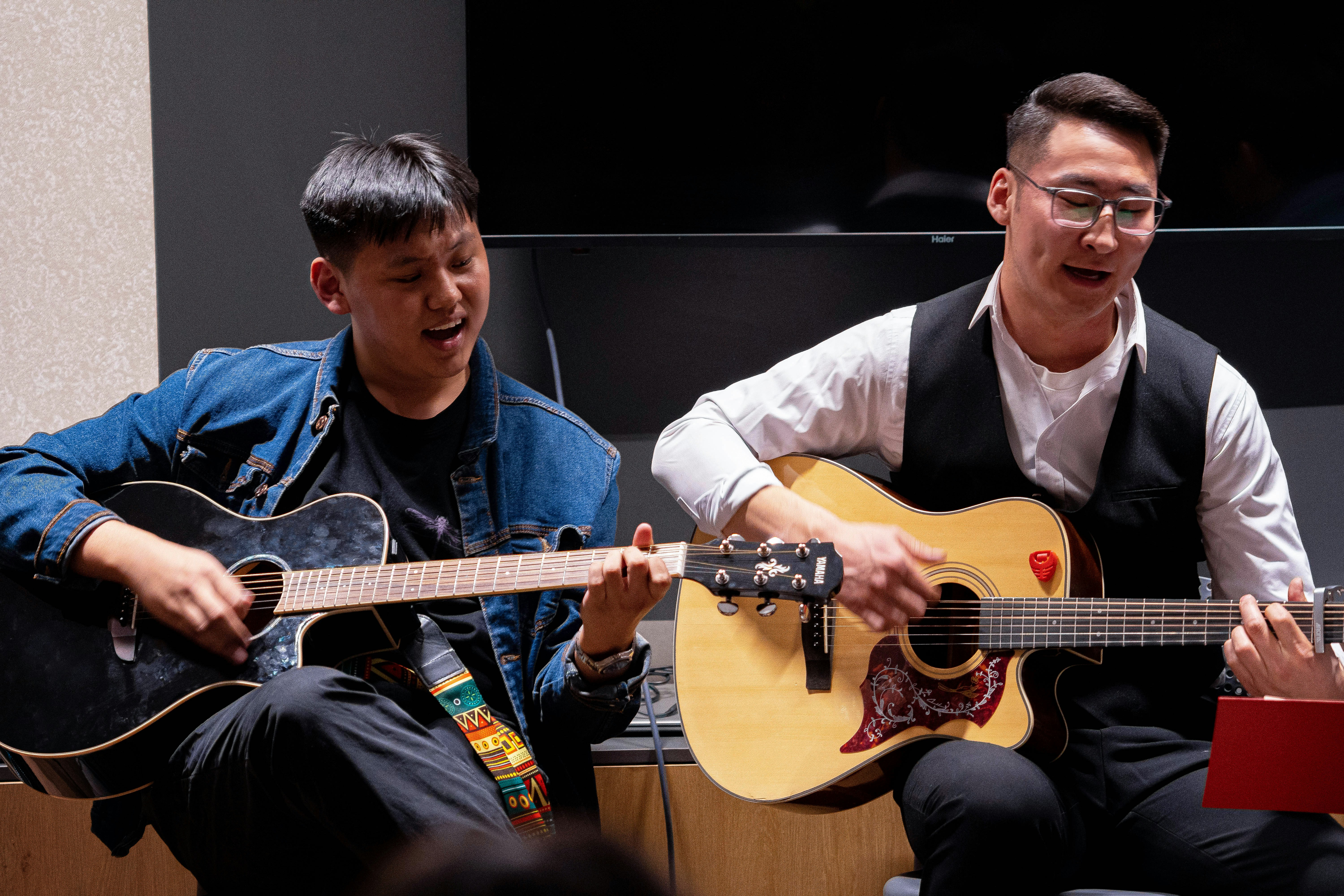 An intimate acoustic moment shared by Mongolian musicians, captured in warm natural light and genuine emotion.