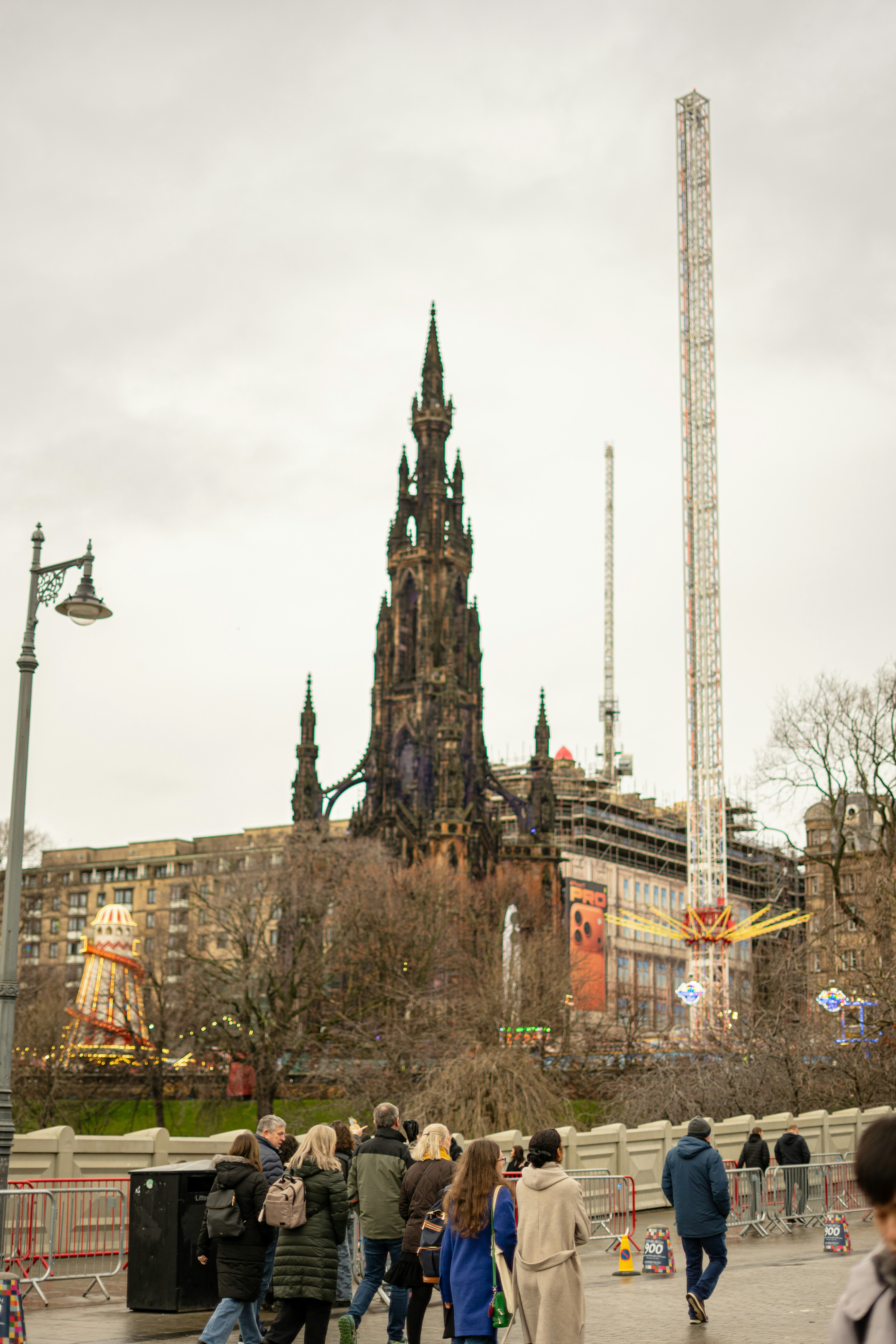 City Square with Gothic Monument Rising Over a Lantern-Filled Park