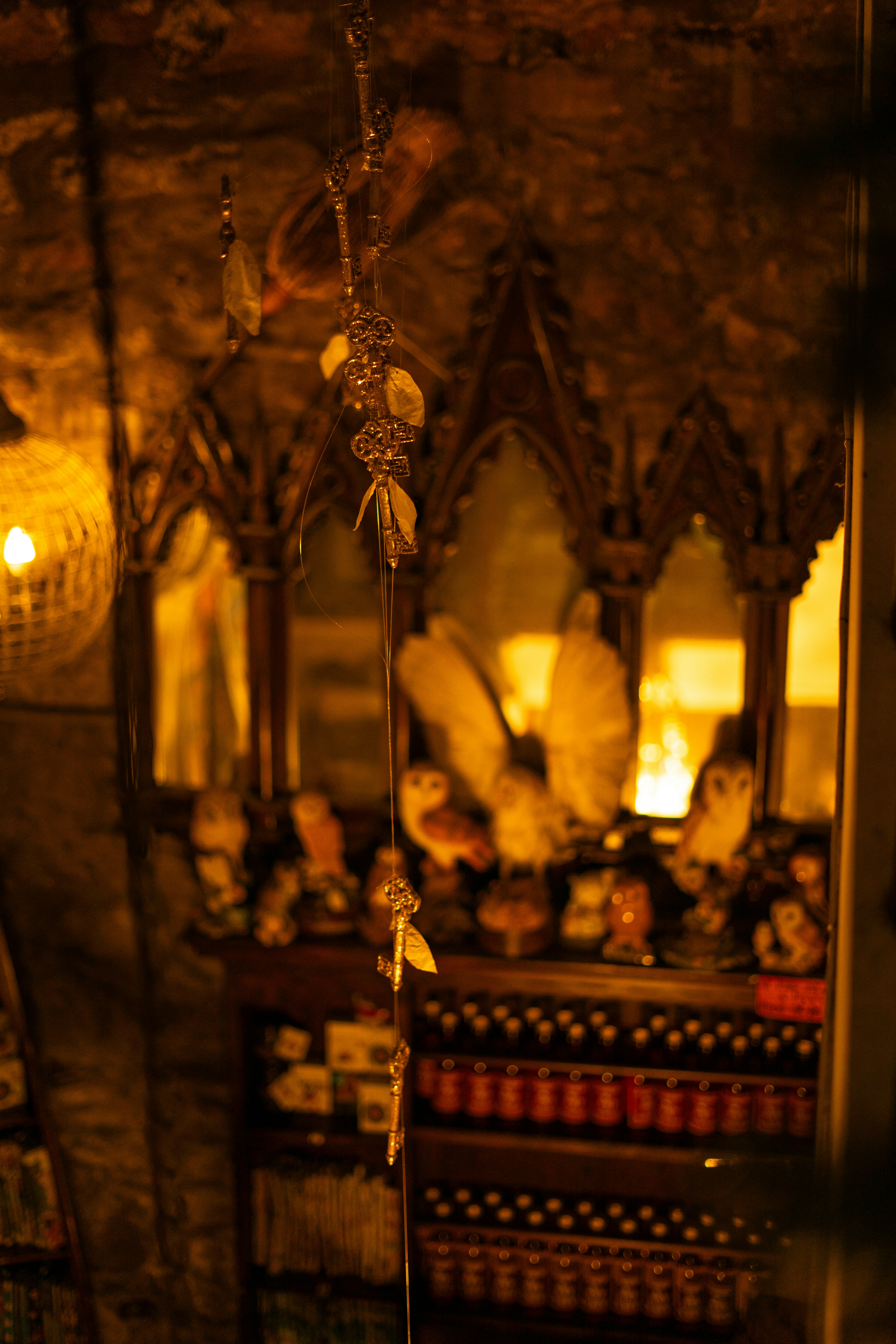 Amber Shrine: Hanging Ornaments in a Dim, Velvet Interior