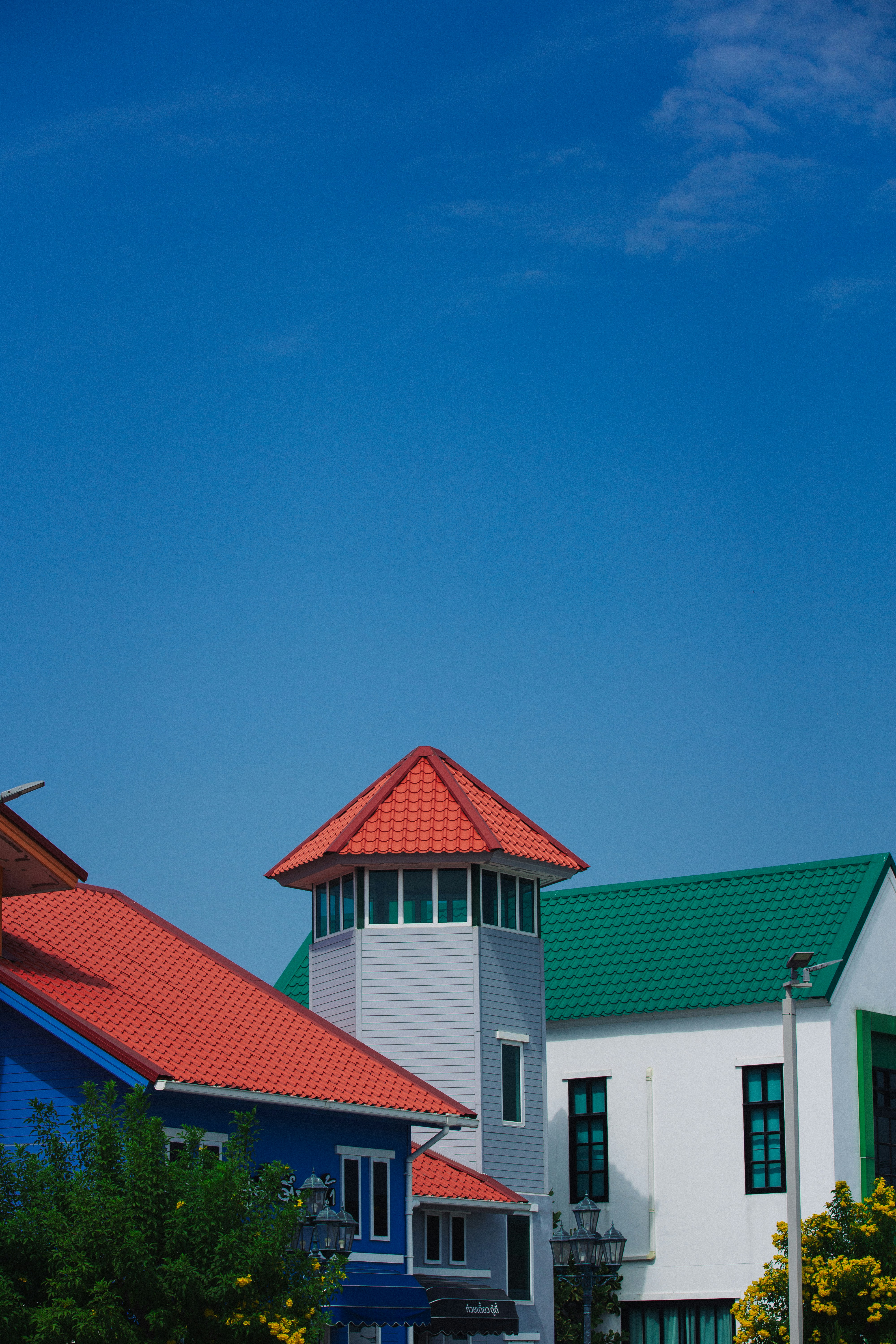 Colorful A-Frame Row: A Quiet Corner Under a Brilliant Sky