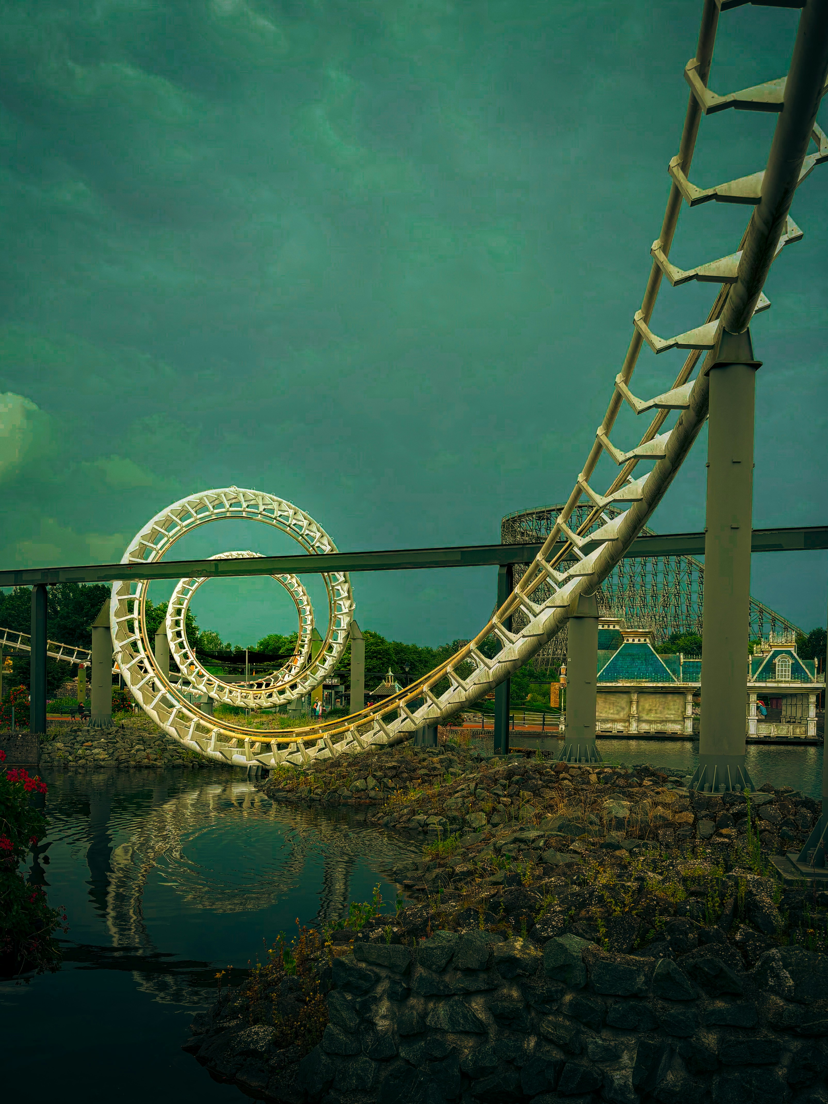 Looping Tracks of Steel Above a Serene Canal