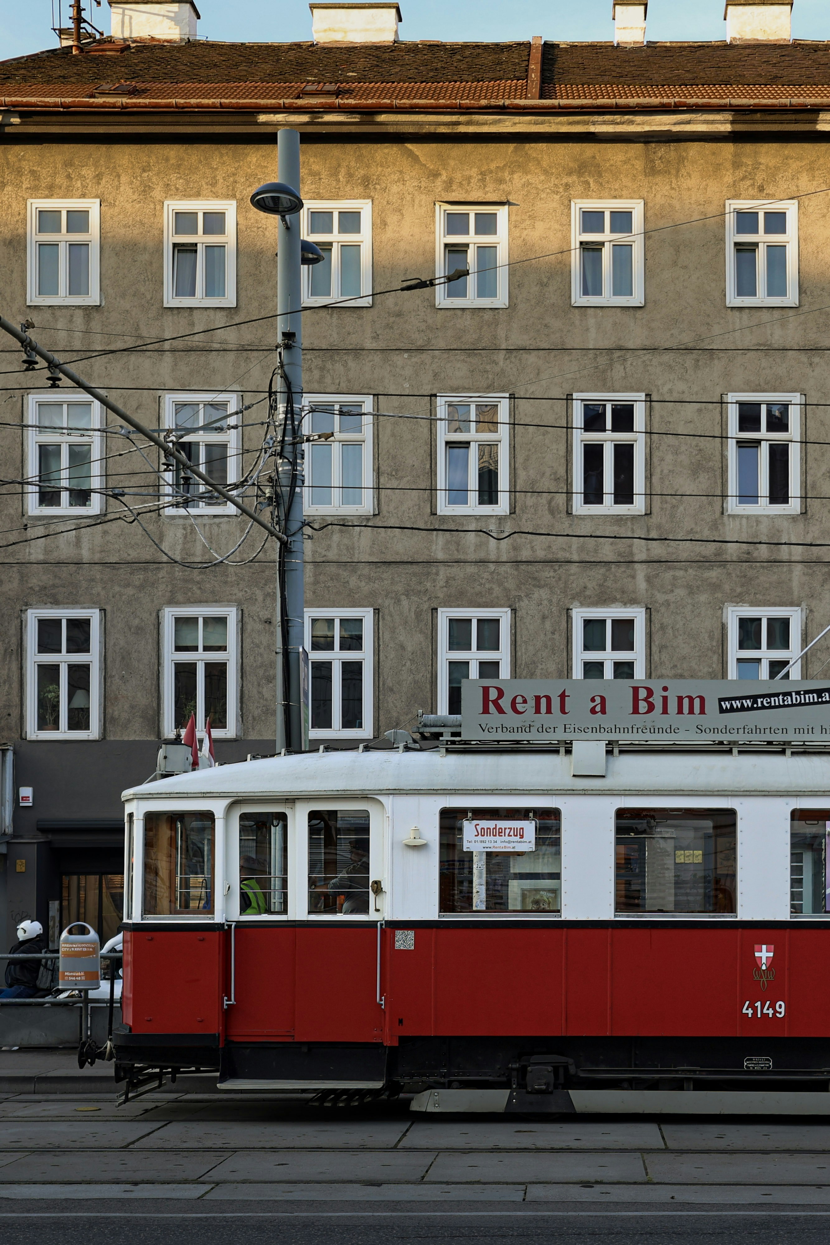 Red Tram at the Edge of Old Town Facades