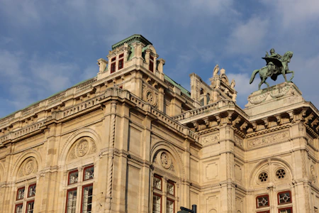 Stone Majesty: a Corner Terrace with a Bronze Charger Beneath a Blue Sky