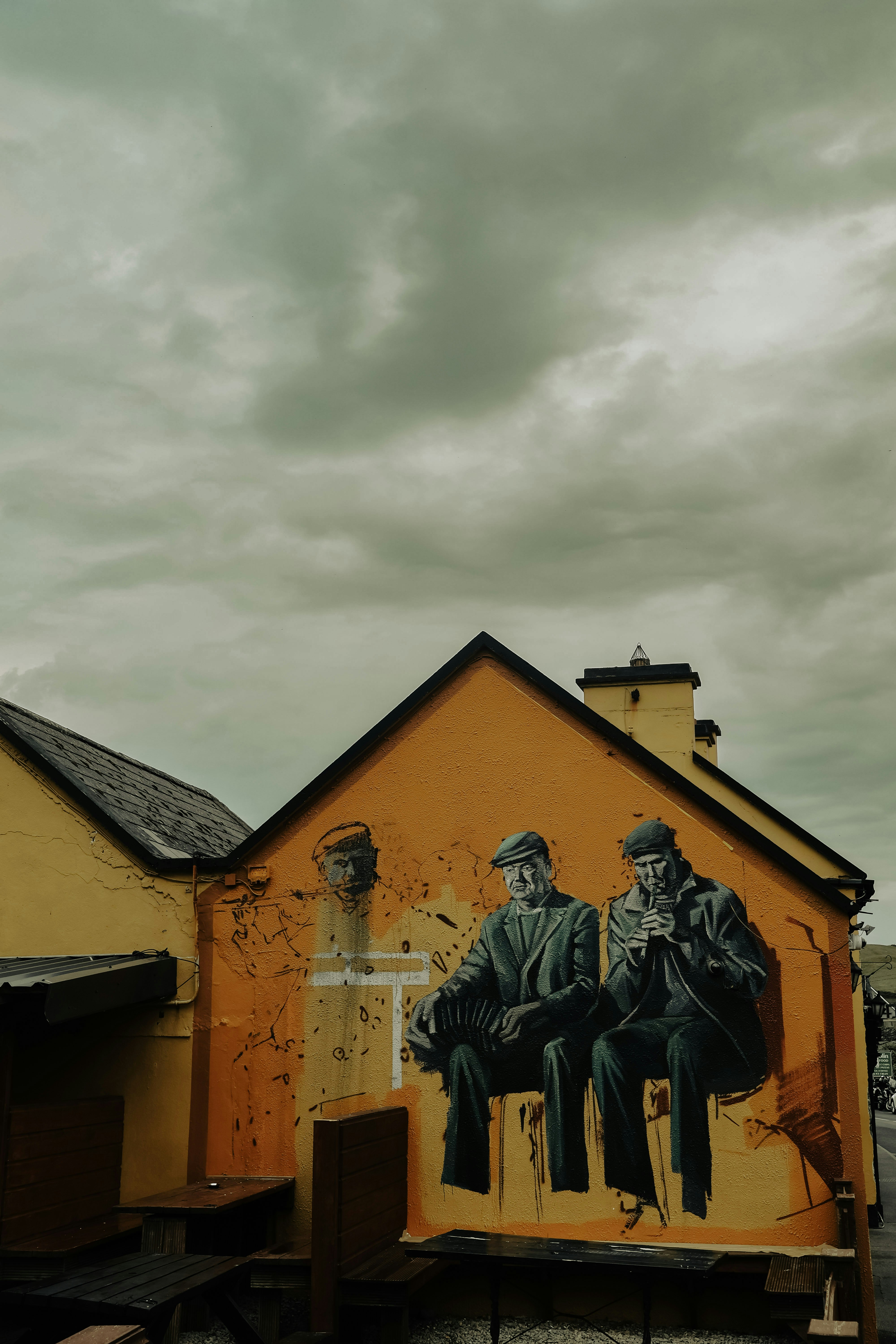 Orange House Portrait: A Graffiti Scene with Monochrome Figures