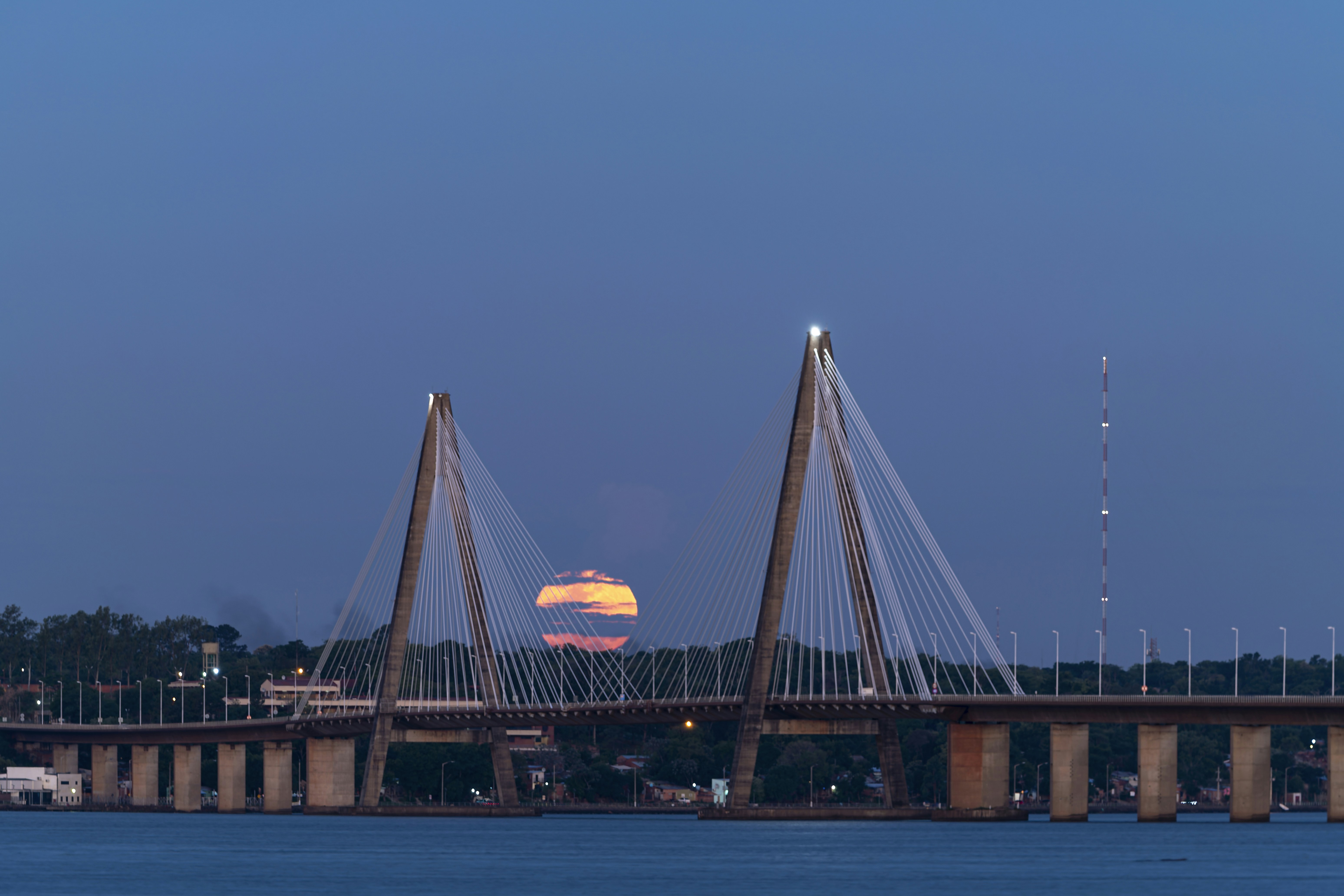 Sunset Soaring: The Cable-Stayed Bridge Framed by a Dimming Sun