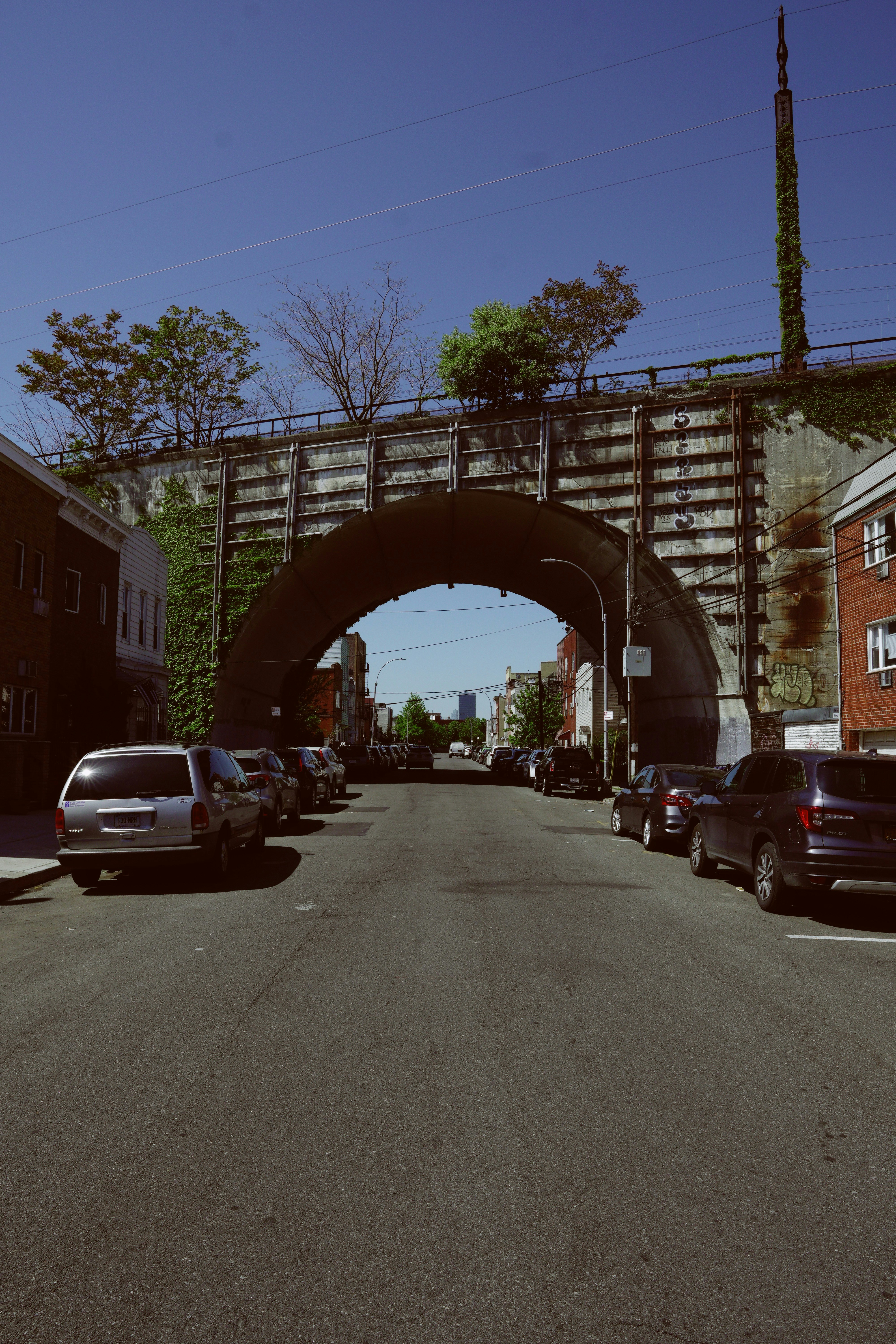 Under the Arch: City Street Framed by a Narrow Tunnel