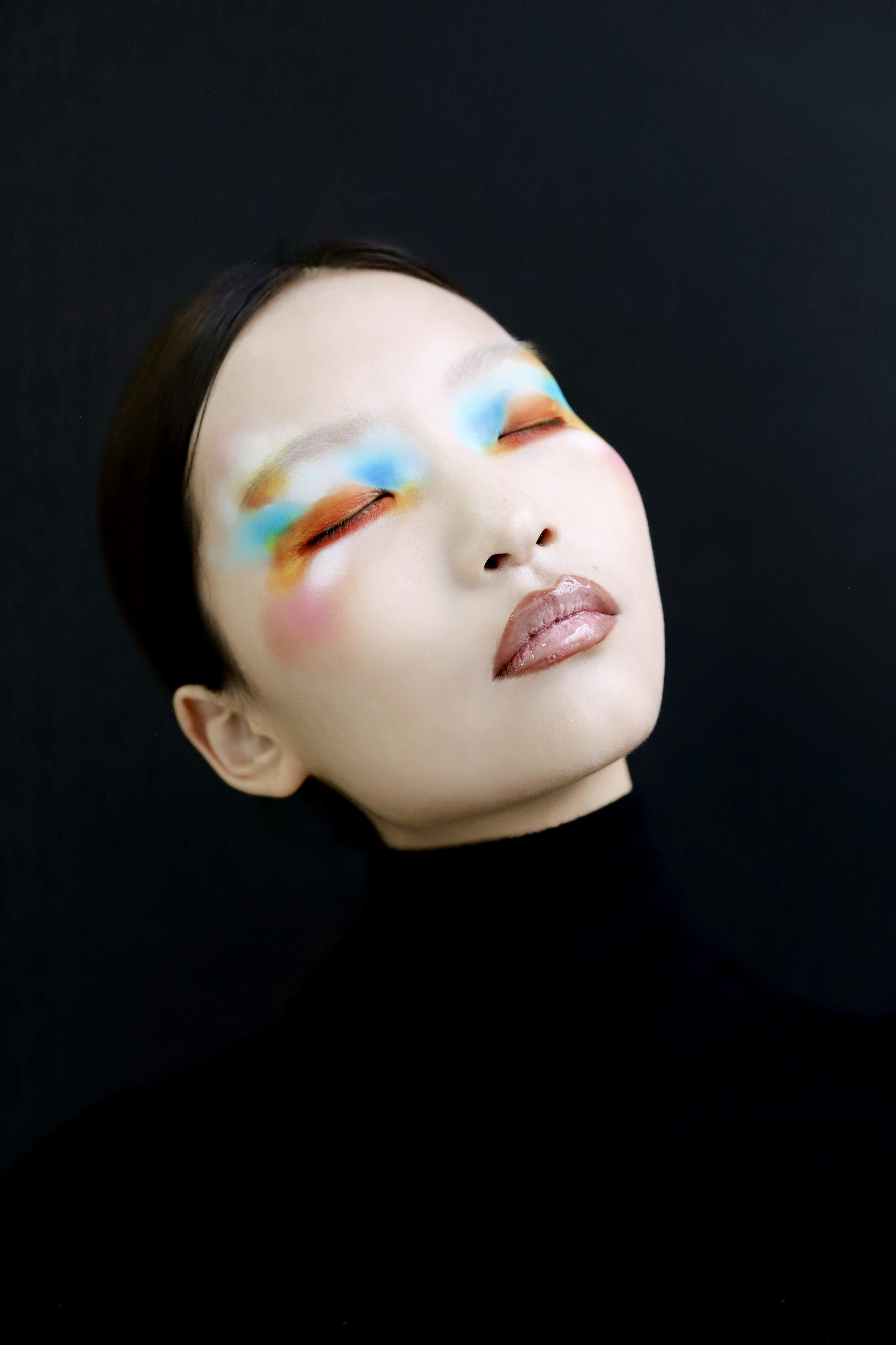 Woman with colorful abstract eye makeup and black turtleneck photo ...