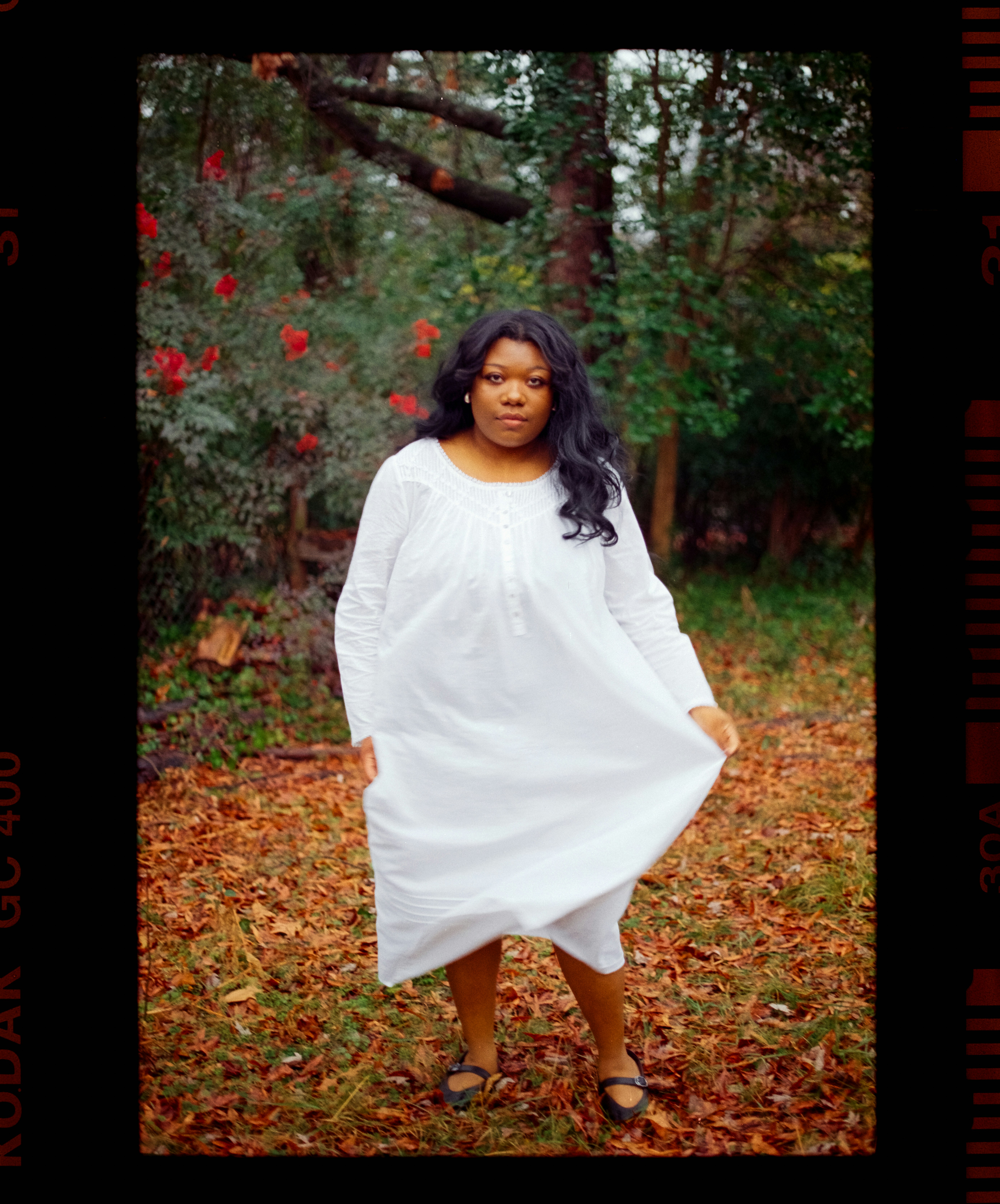 White-dressed portrait in autumn garden