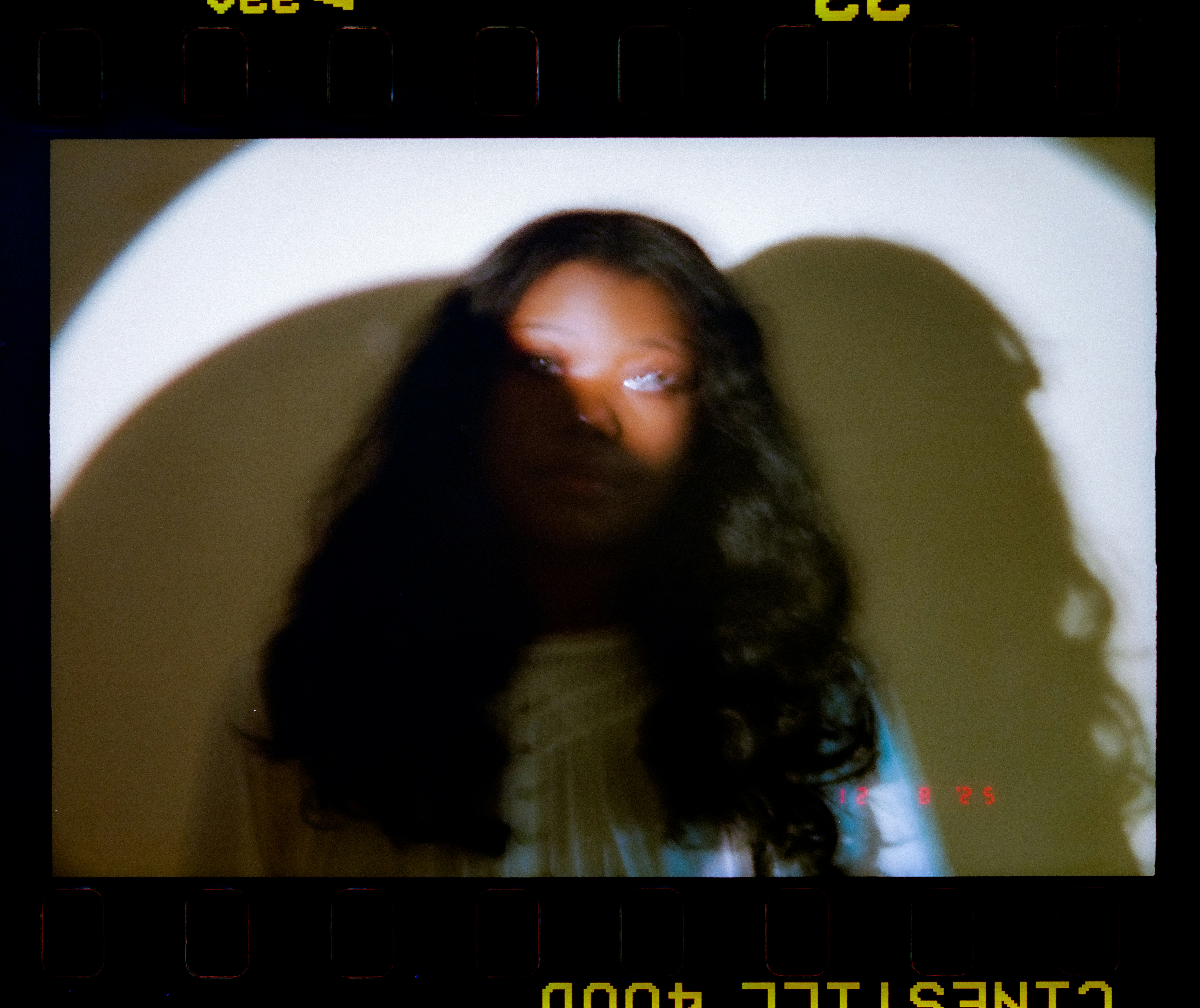 Soft Circle of Light Illuminates a Blurred Portrait