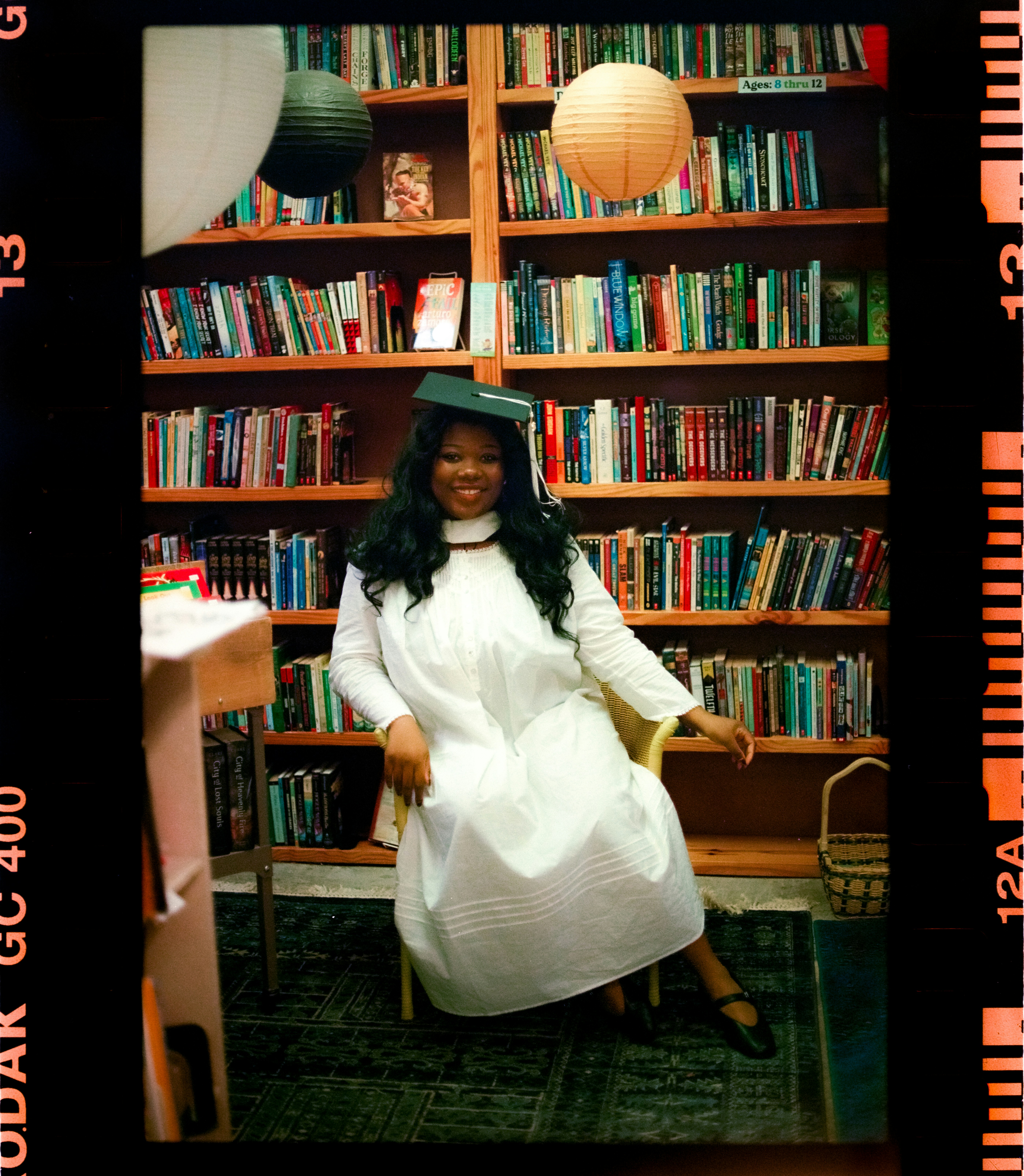 Graduation Moment in a Library Garden: A Smile Beneath the Cap