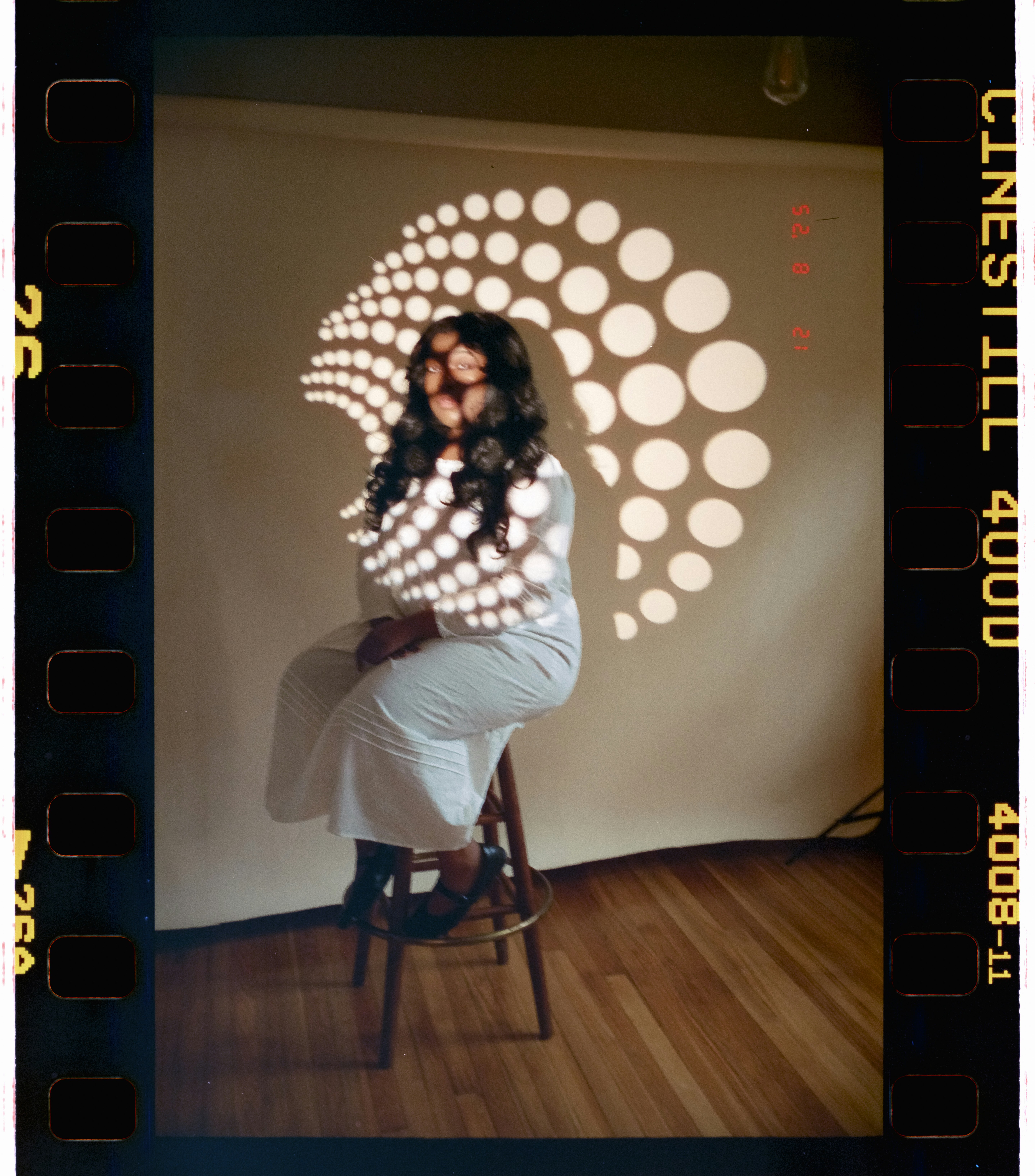 Spiral Projection: Portrait in front of a Circular Light Pattern