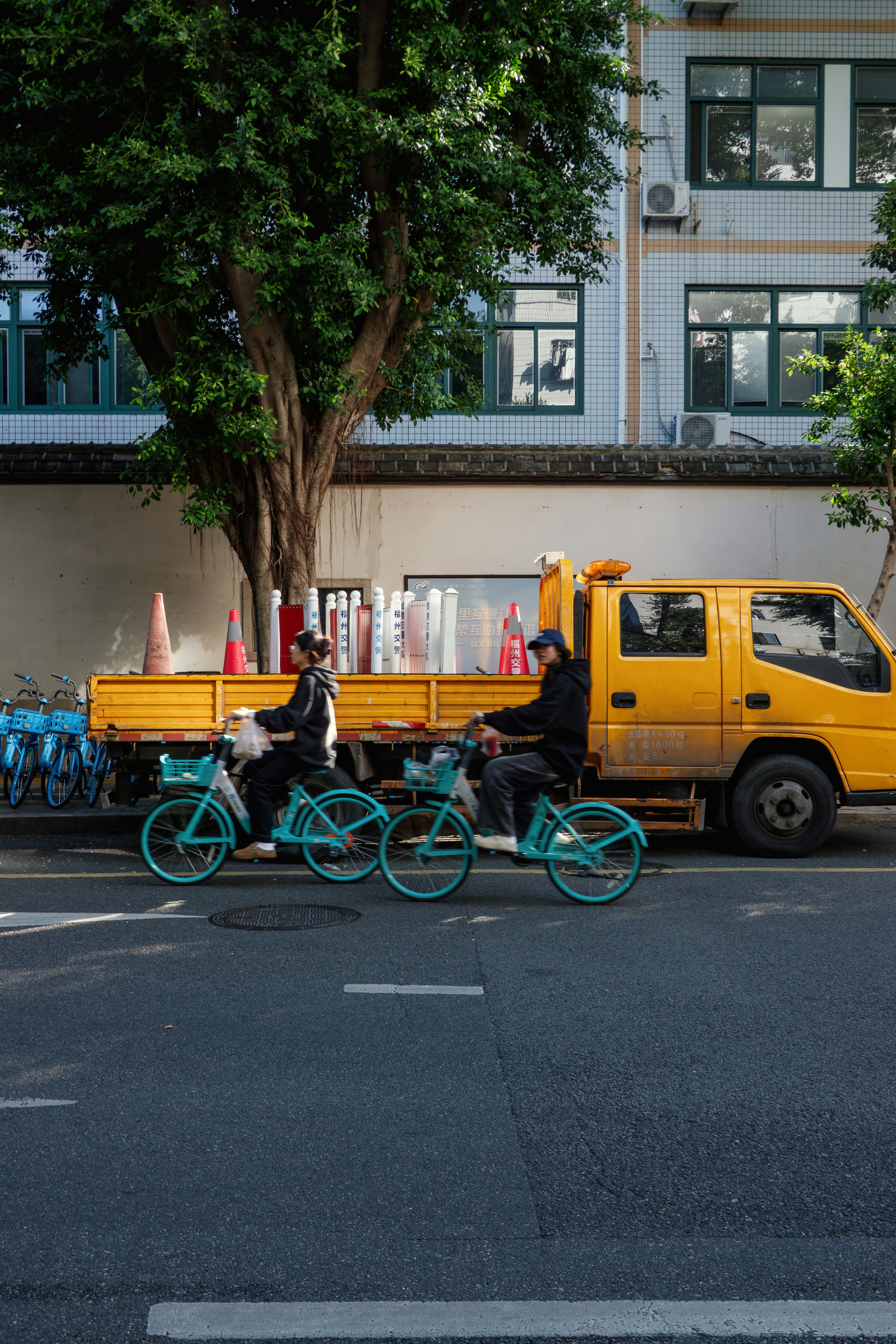 Teal Runners Along a Yellow Truck Bed