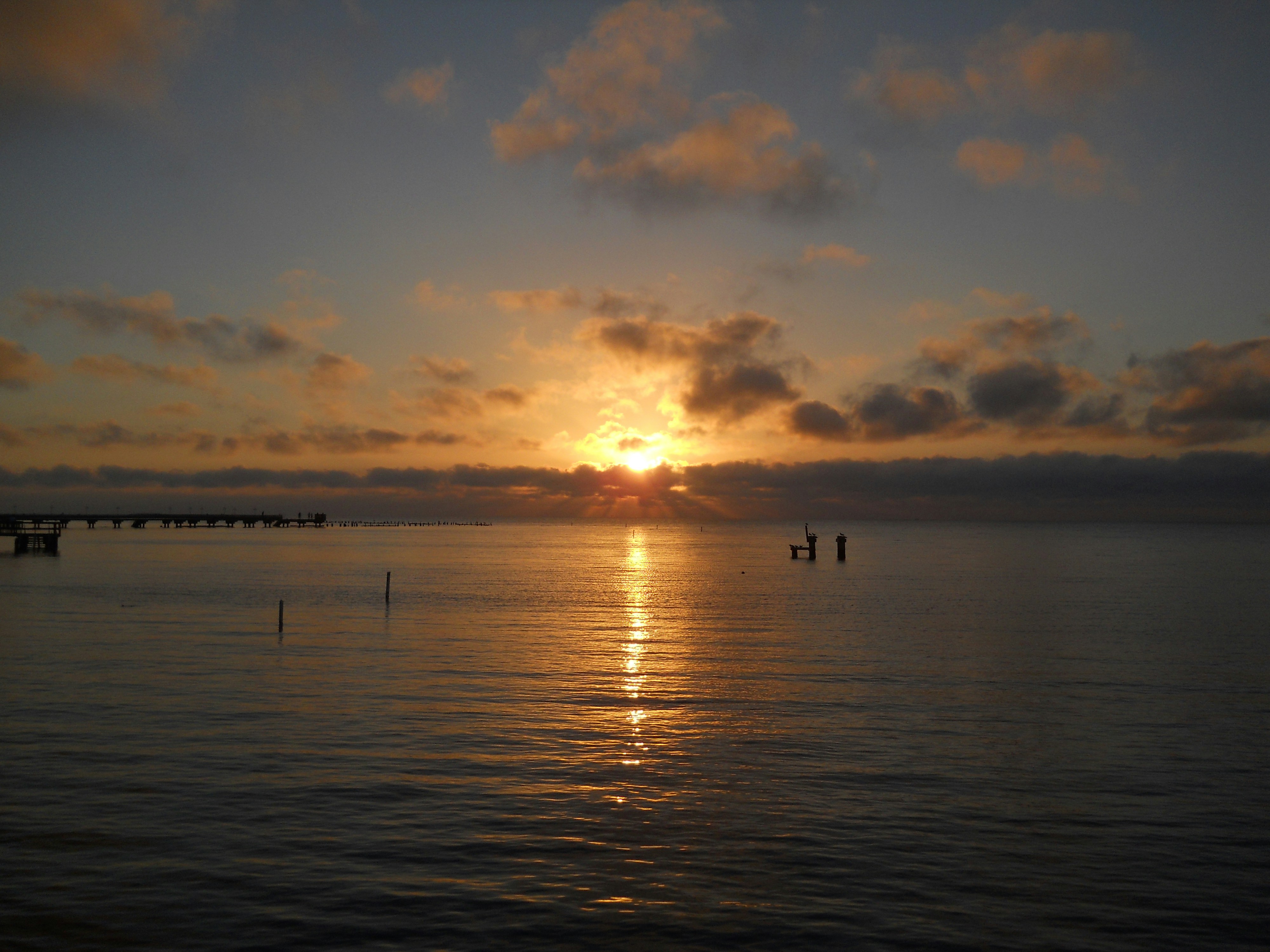 Silhouette of a Sunset over a Quiet Horizon