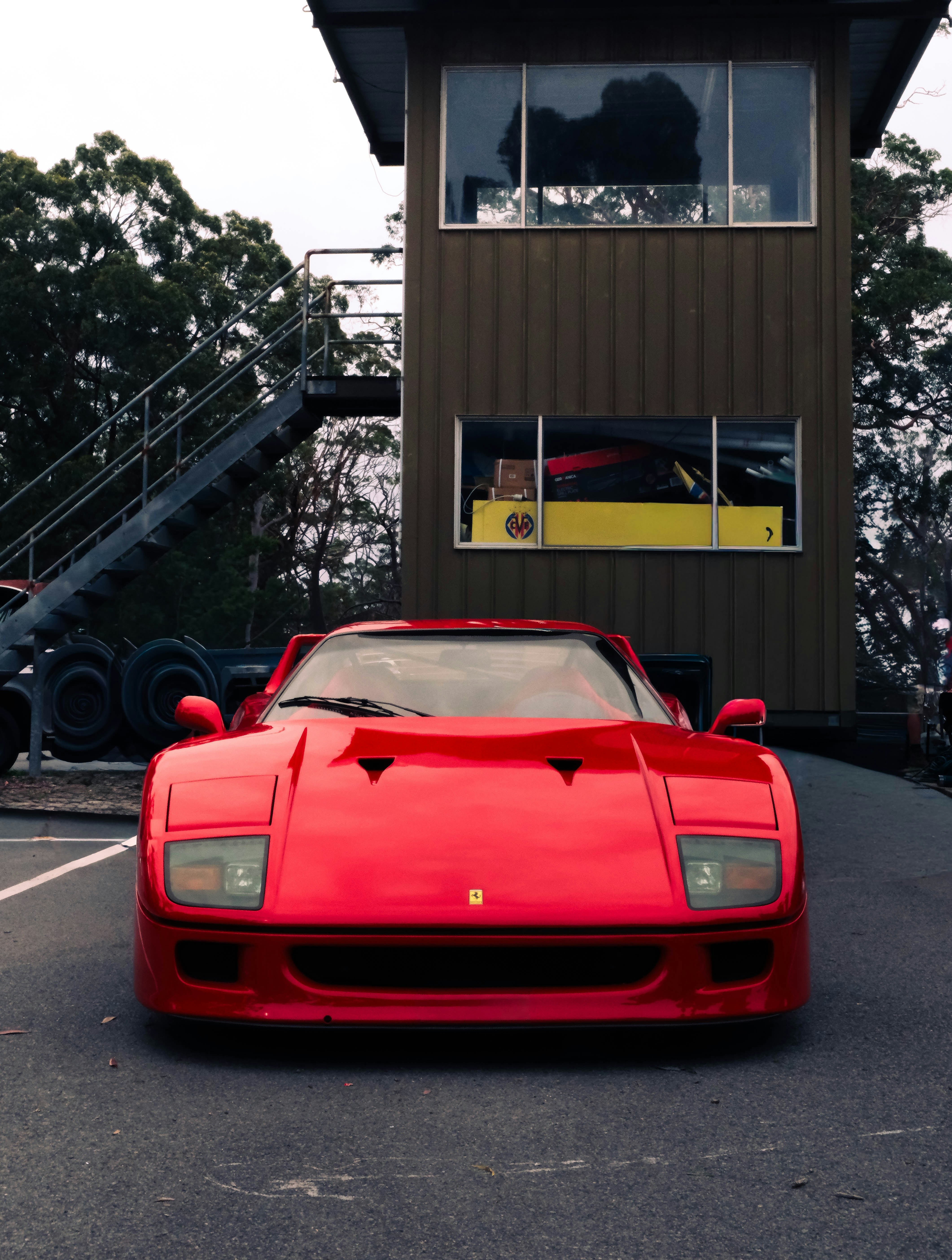 Red Sprite at the Pit Stop: Ferrari in Front of the Tower