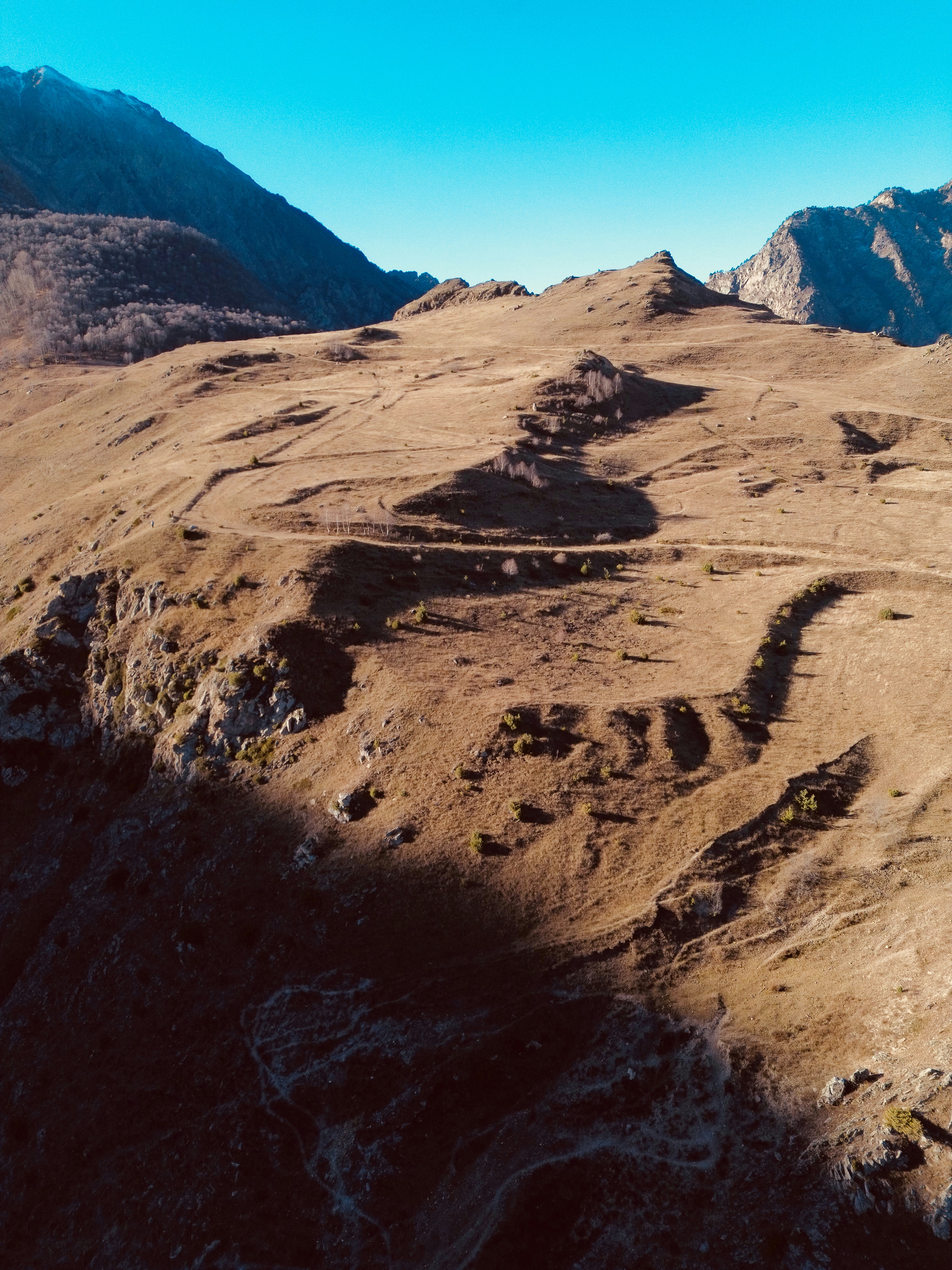 Wind-Worn Terraces under a Clear Blue Dome