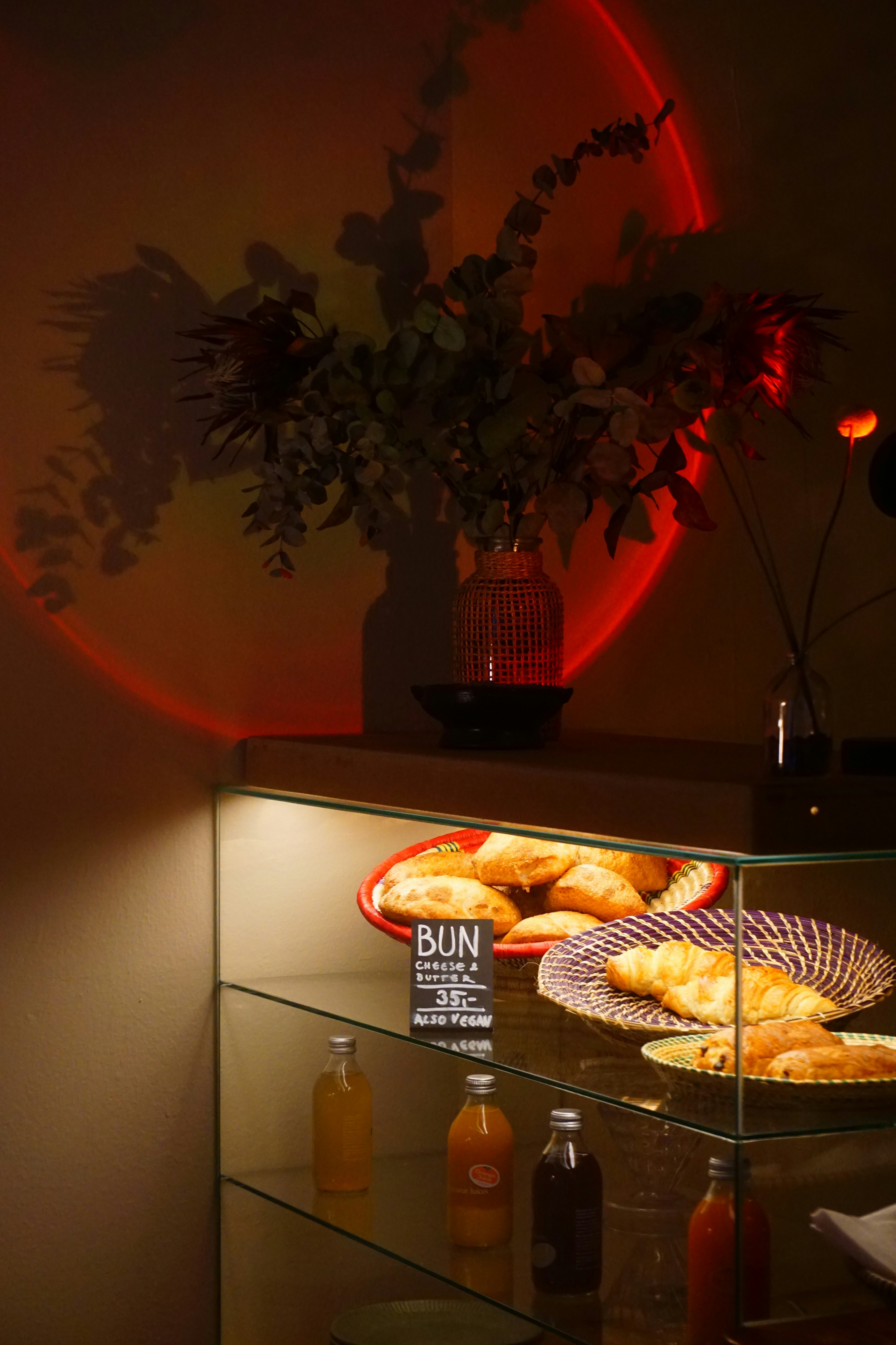 Soft Café Glow: Pastries Under a Red Halo