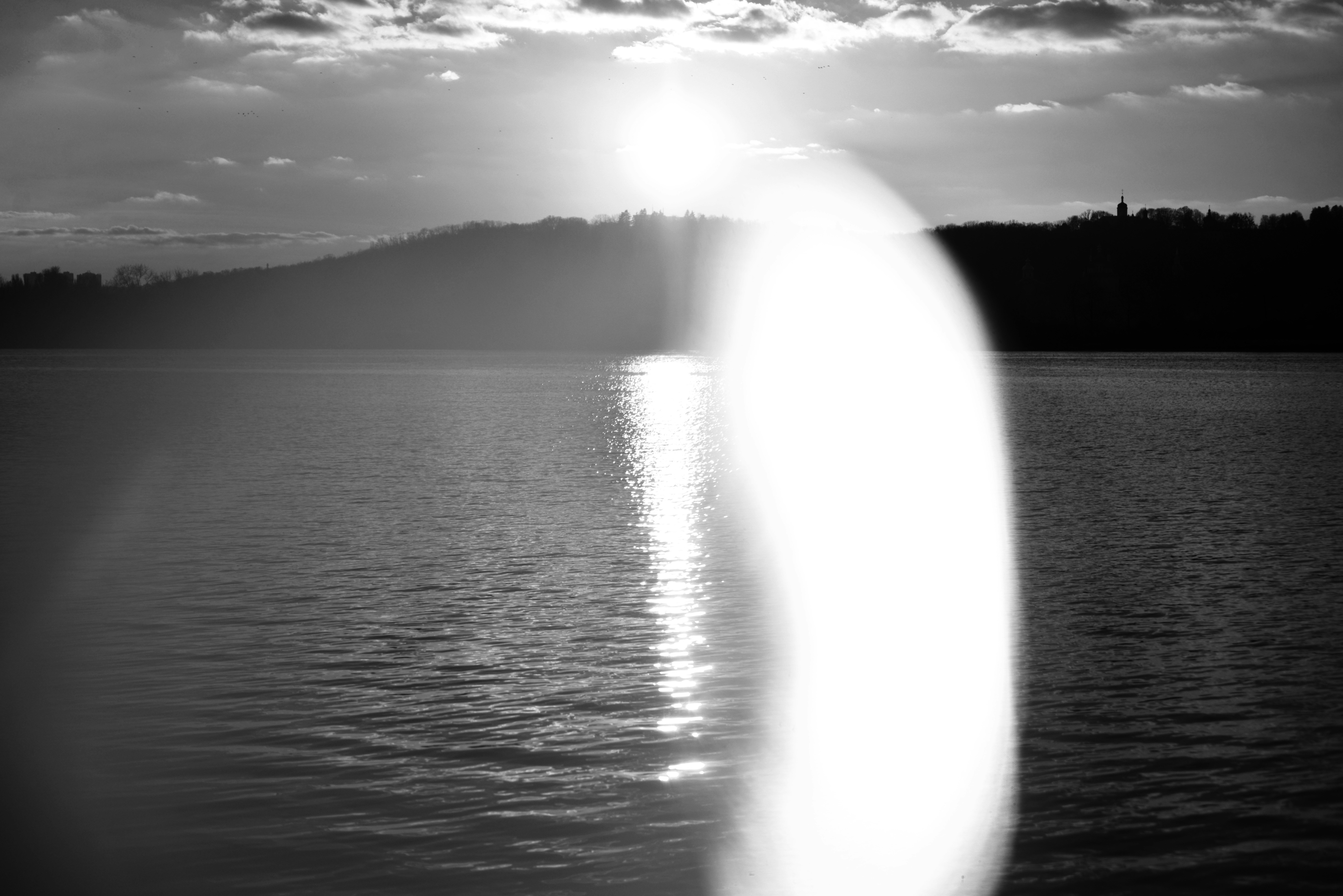 Golden Arc: A Solar Curve Over a Quiet Lake