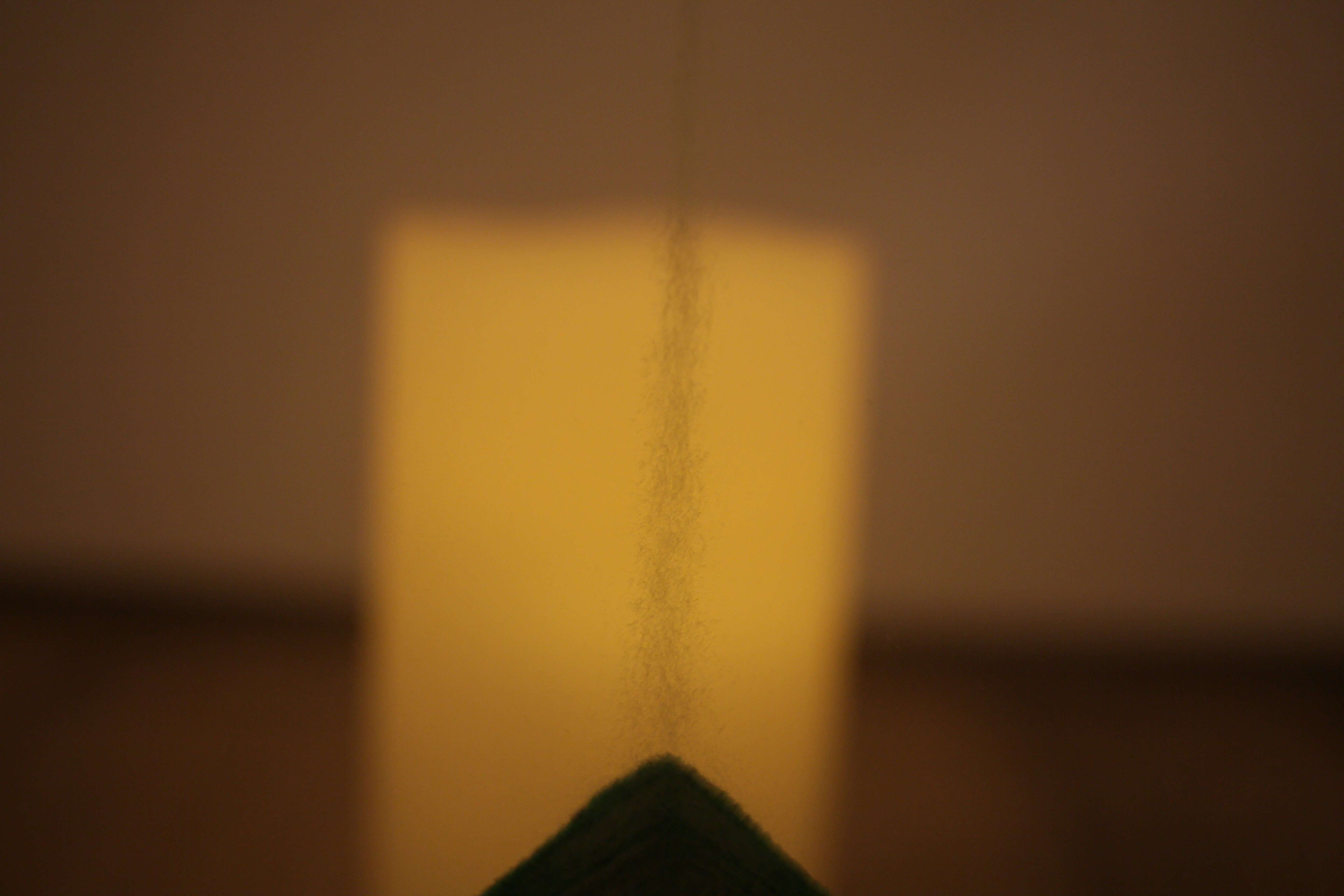 Cascading Sand and Light: A Quiet Glow Above a Soft Pyramid