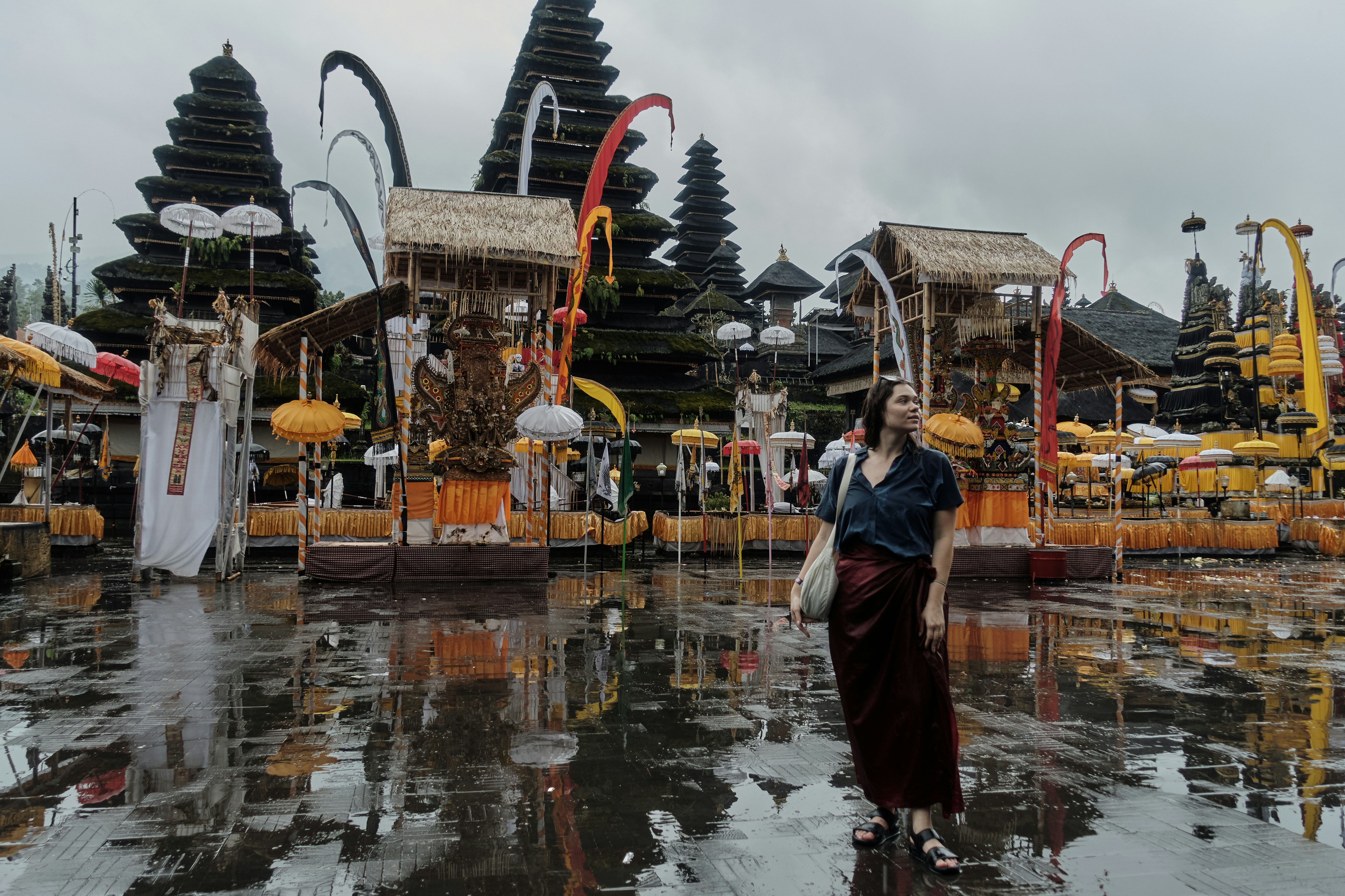 Woman standing in front of traditional balinese temples