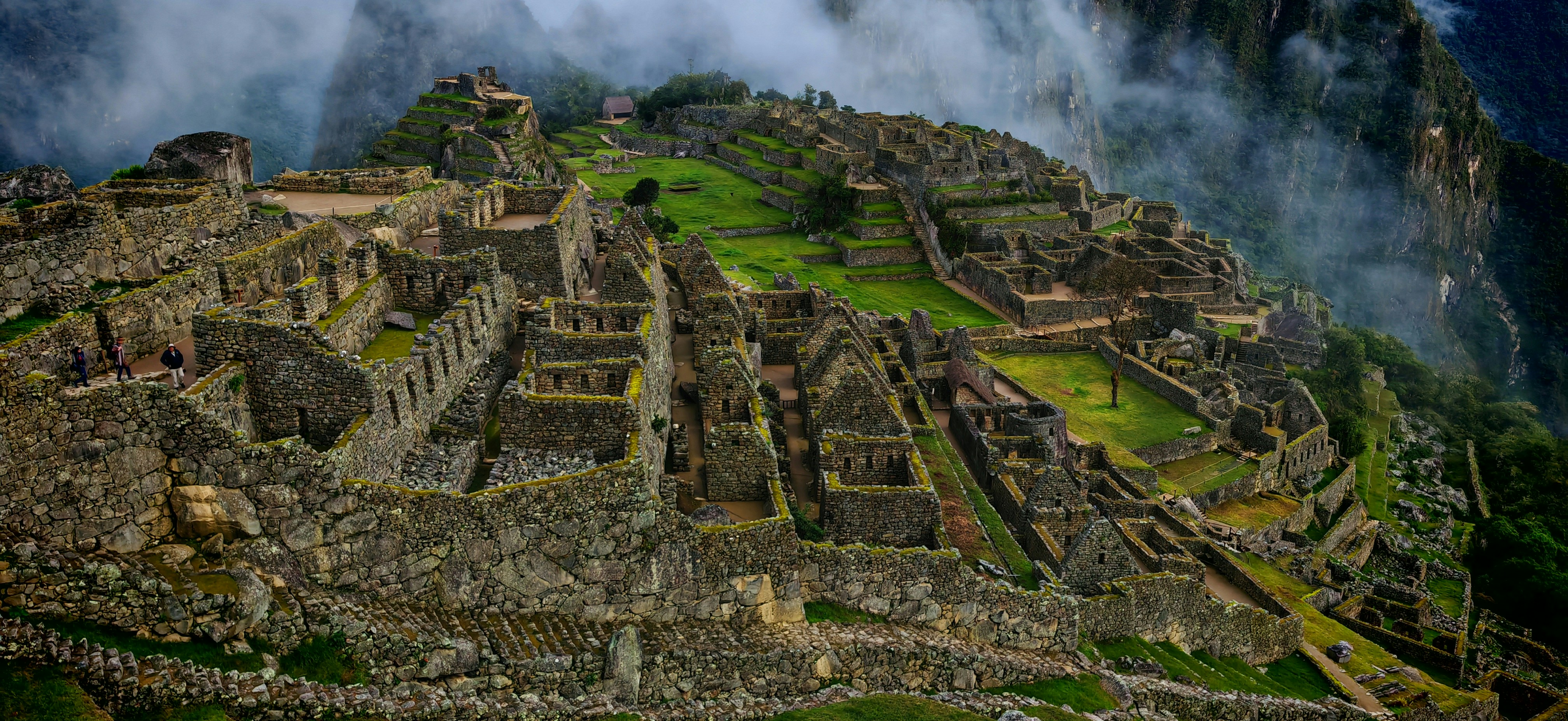 Ancient stone ruins on a misty mountainside