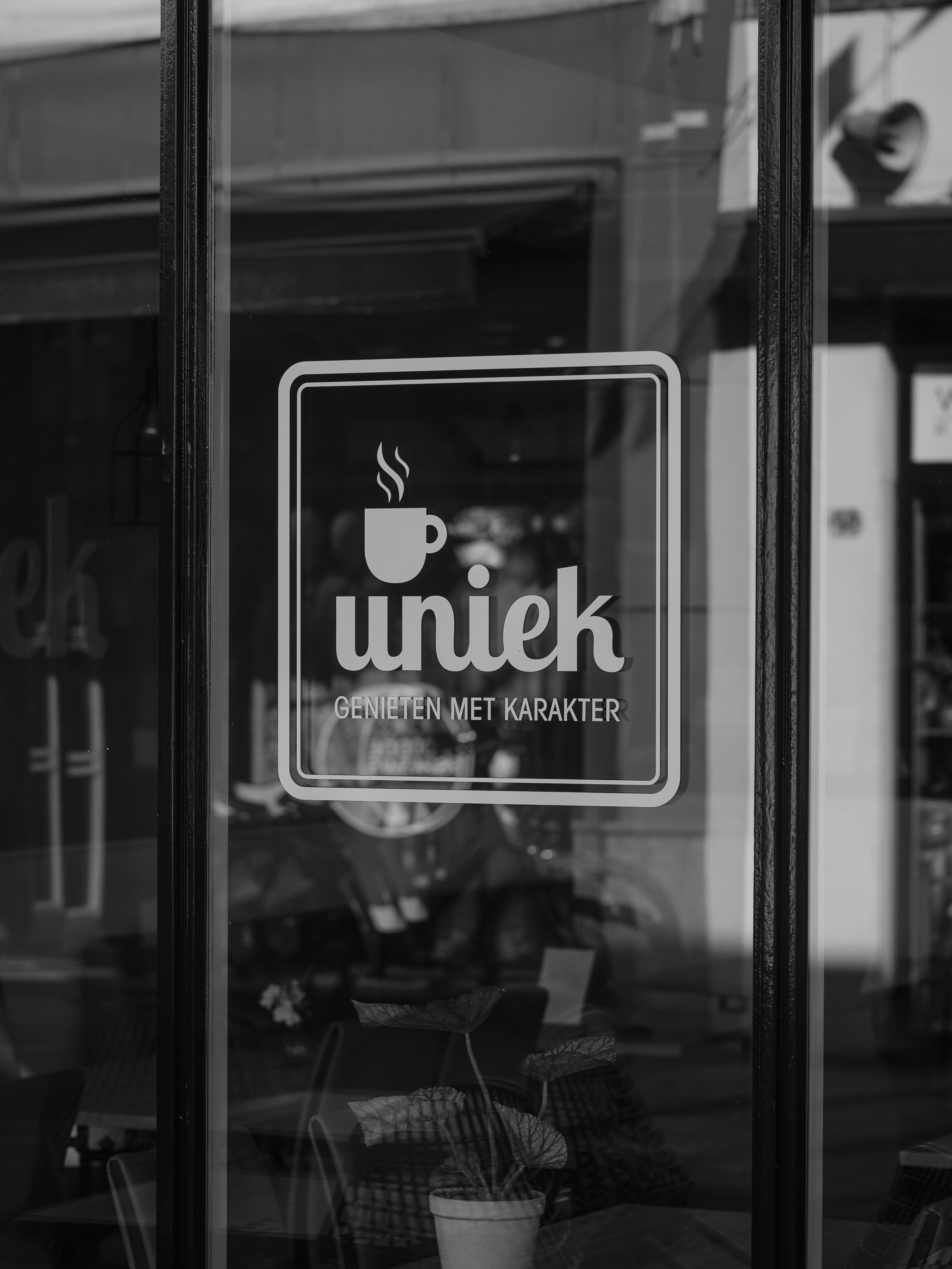 Cafe Window Sign in Monochrome: A Quiet Moment Inside