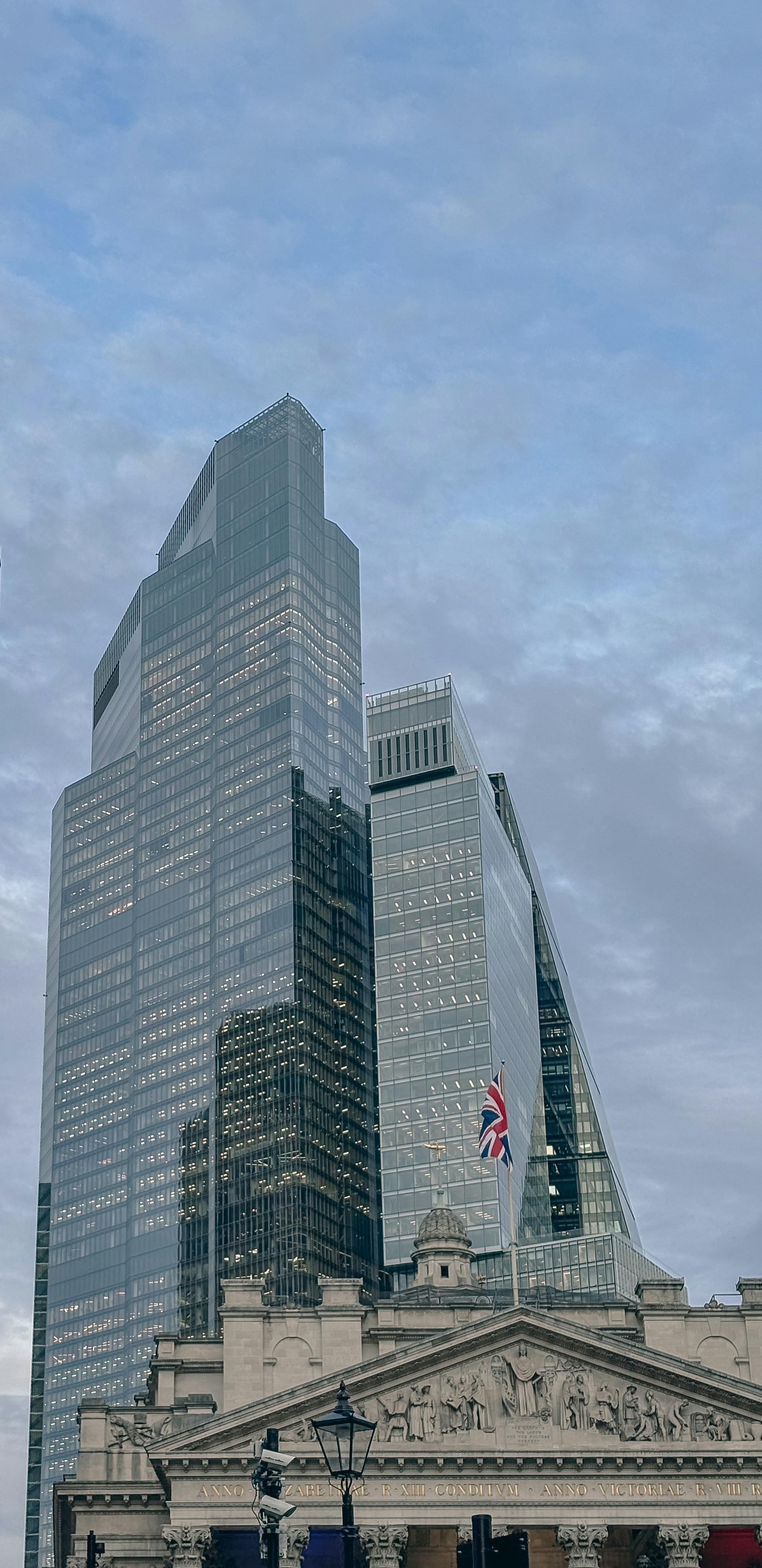 City Cannon: A Glass-Tide Skyscraper Duo Rising Over Historic Facade